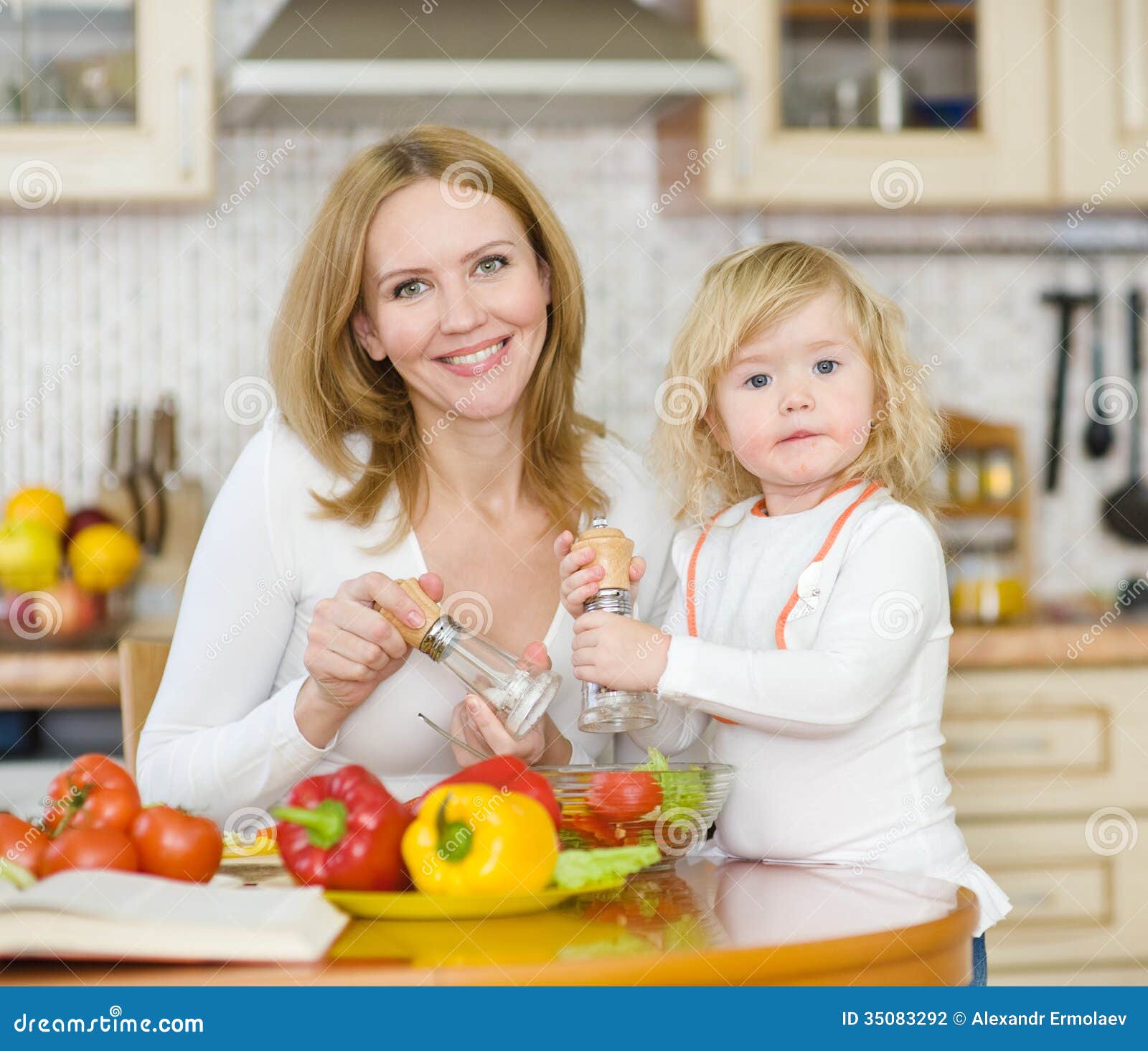 Mother and Daughter Eating Vegetables Salad Stock Photo - Image of ...