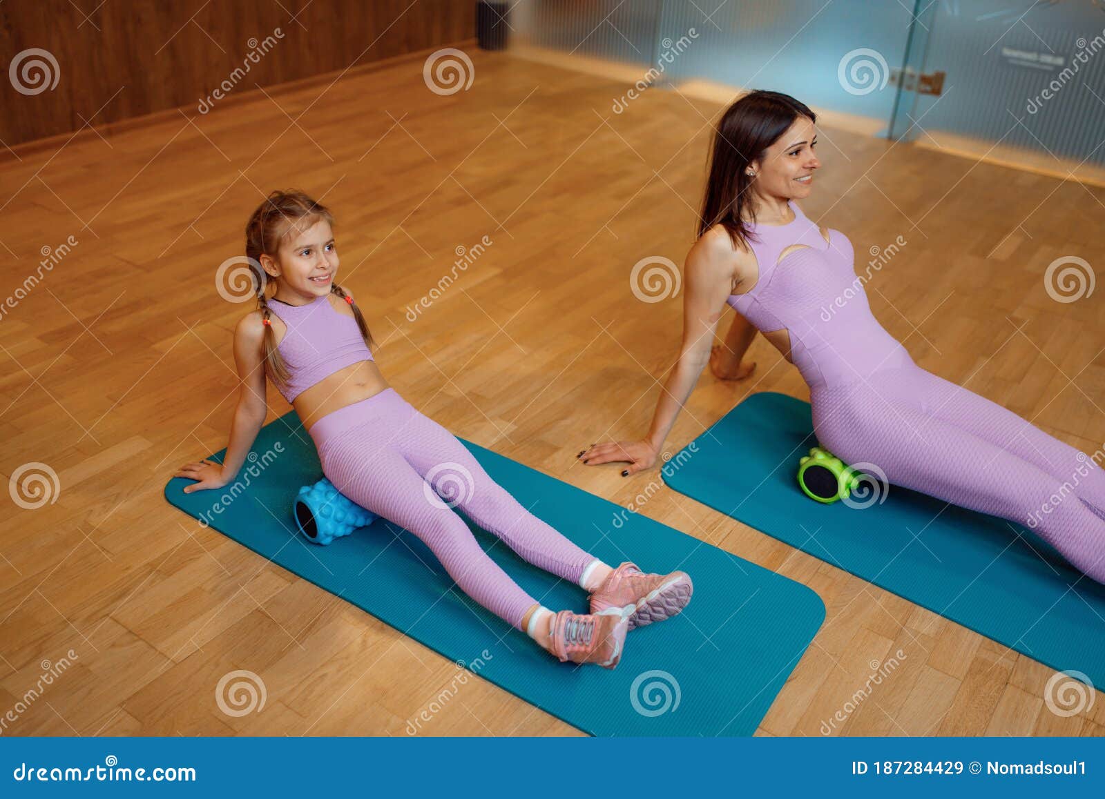 Mother And Daughter In Gym Exercise With Rolls Stock Image Image Of