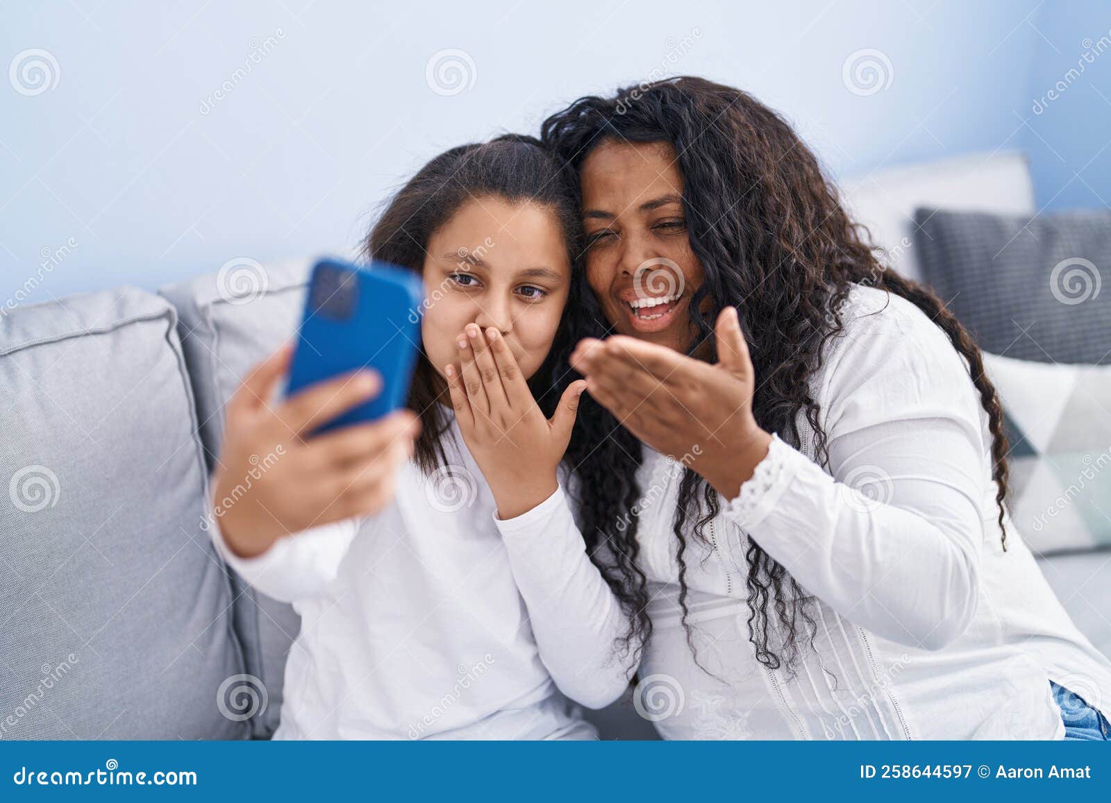 Mother and Daughter Having Video Call Sitting on Sofa at Home Stock ...
