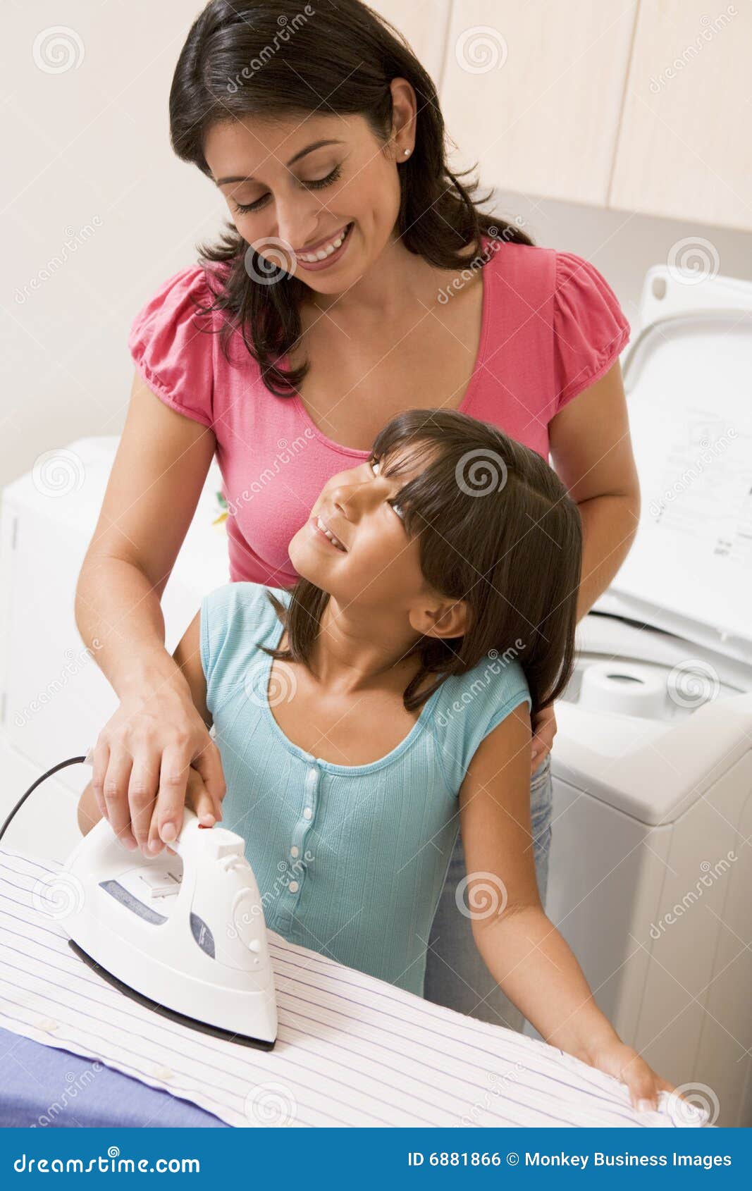 Mother and Daughter Ironing Stock Photo - Image of looking, thirties ...
