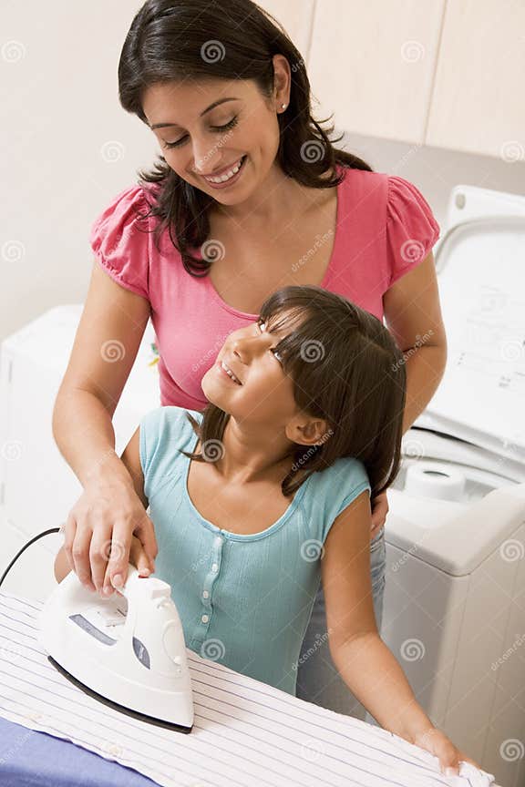 Mother and Daughter Ironing Stock Photo - Image of looking, thirties ...