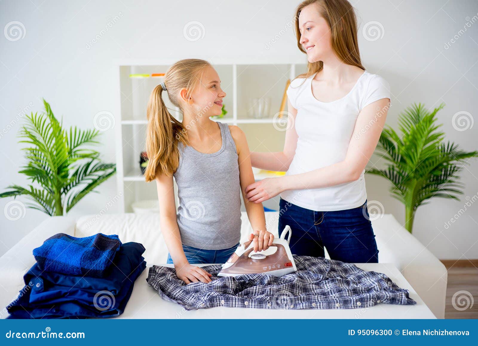 Mother and Daughter Ironing Together Stock Photo - Image of girl, board ...