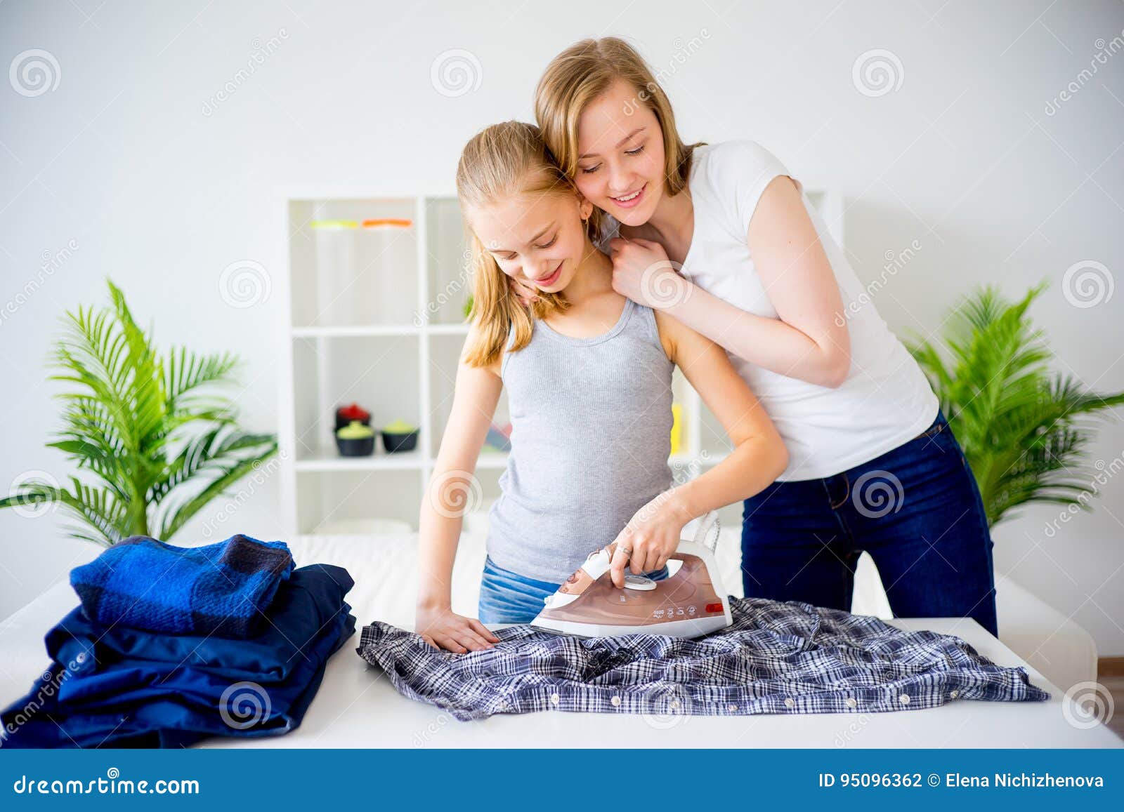 Mother and Daughter Ironing Together Stock Photo - Image of beautiful ...