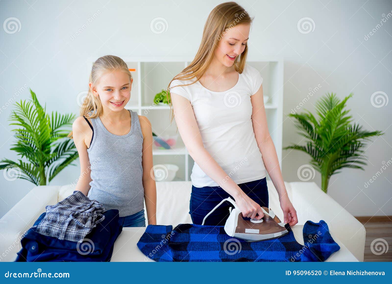 Mother and Daughter Ironing Together Stock Photo - Image of ironing ...