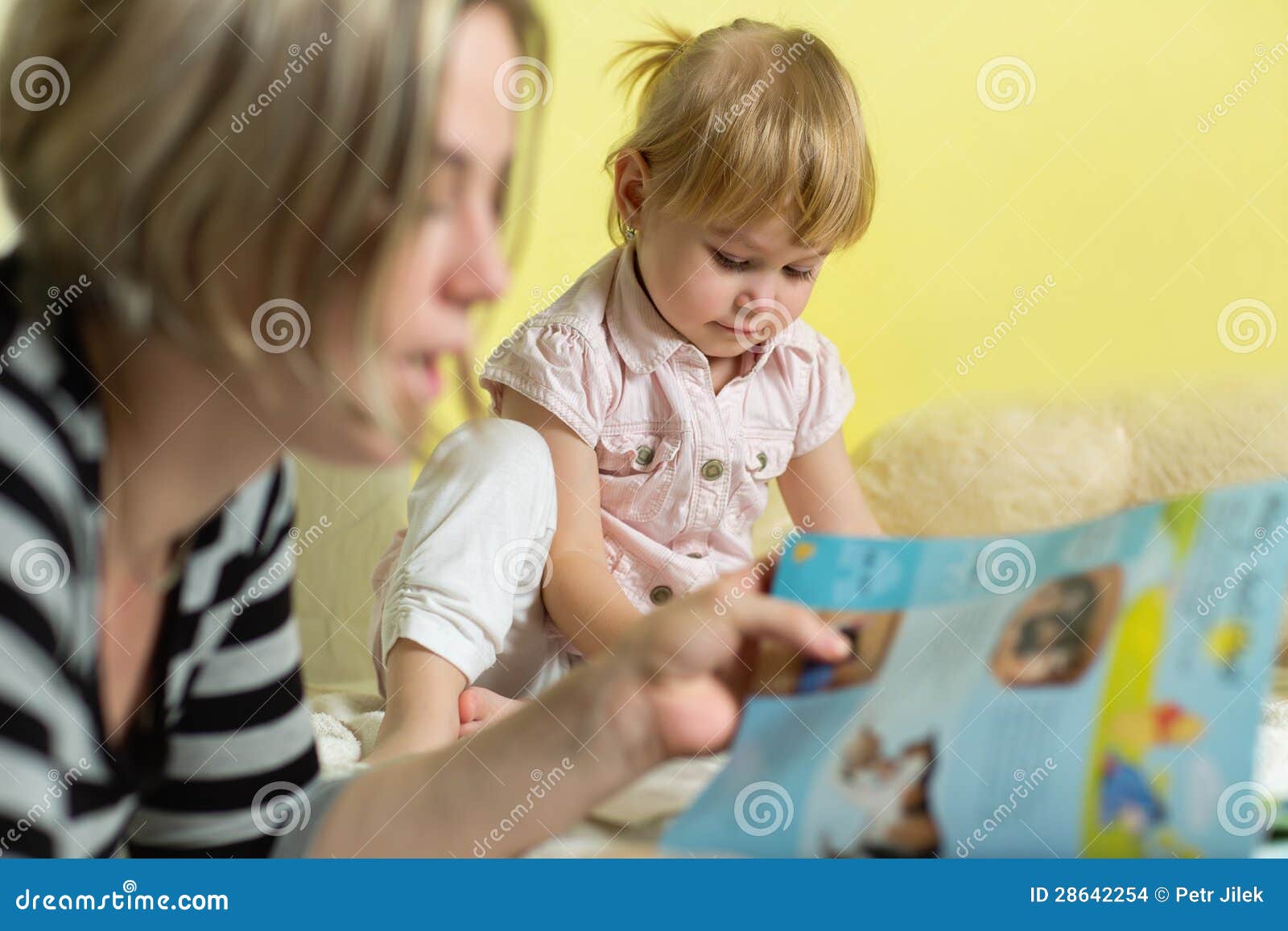 Mother and Daughter in a Joint Game Stock Photo - Image of home, casual ...