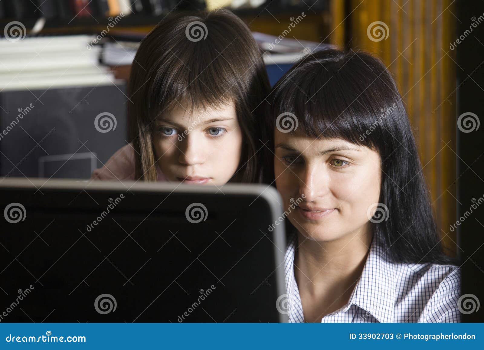 Mother and Daughter Looking at Computer Screen Stock Image - Image of ...