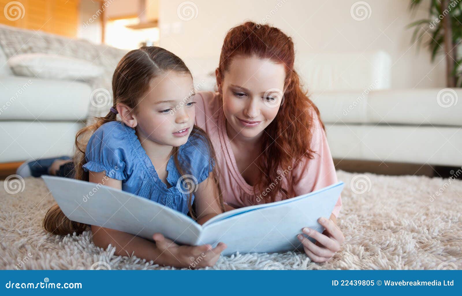 Mother and Daughter Looking at a Magazine Stock Image - Image of novel ...