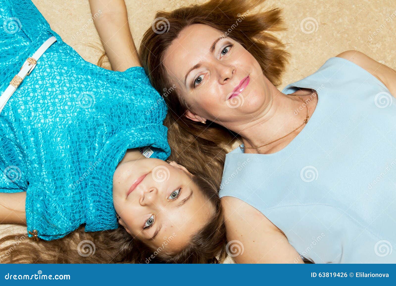Mother and Daughter Lying on the Floor. Stock Photo - Image of love ...