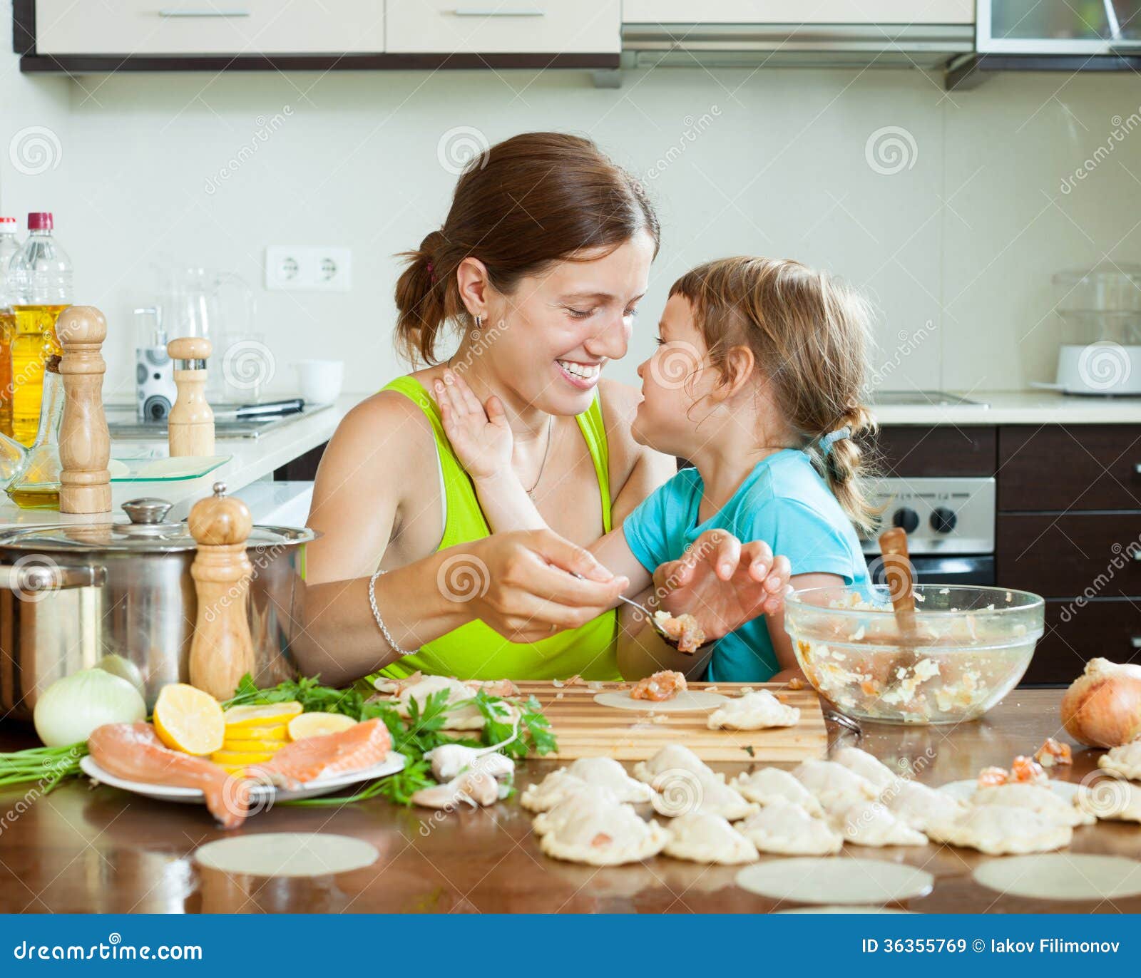 Mother with Daughter Making Fish Dumplings at Home Kitchen Stock Image ...