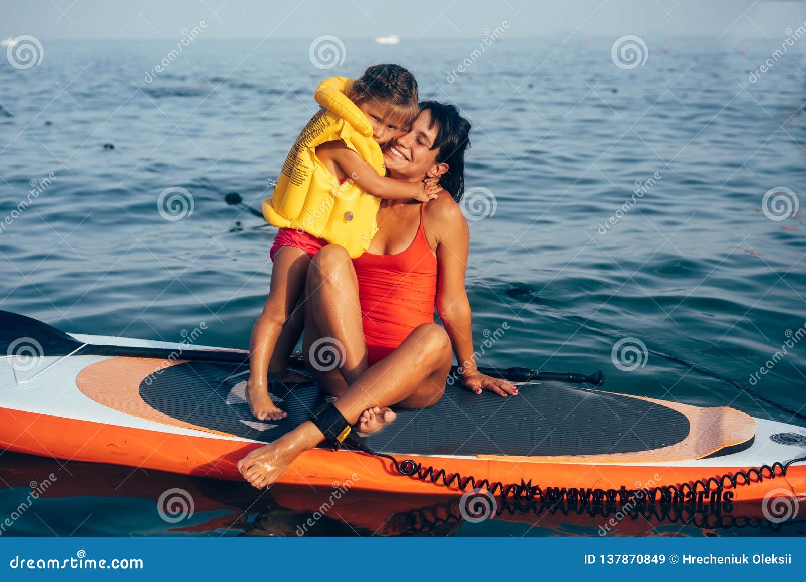 Mother with Daughter on a Paddle Board Stock Image - Image of joyful ... Mother with Daughter on a Paddle Board Stock Image - Image of joyful ...