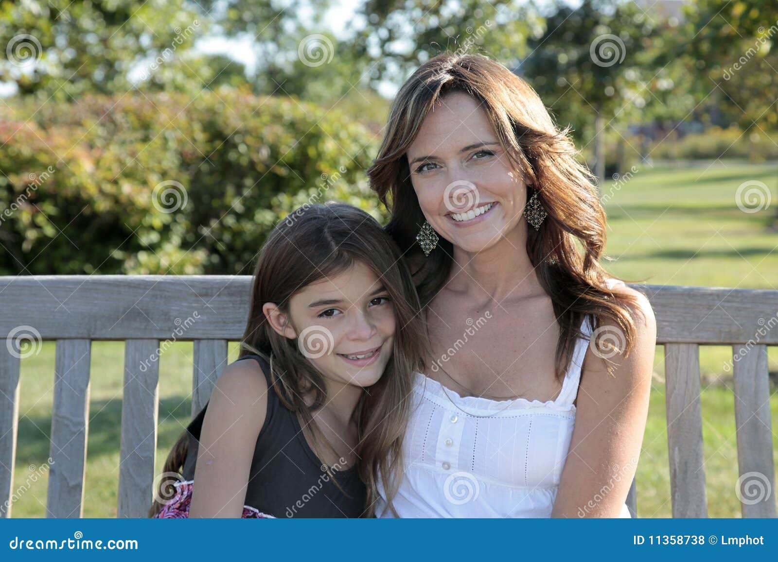 Mother and Daughter on Park Bench Stock Photo - Image of people ...