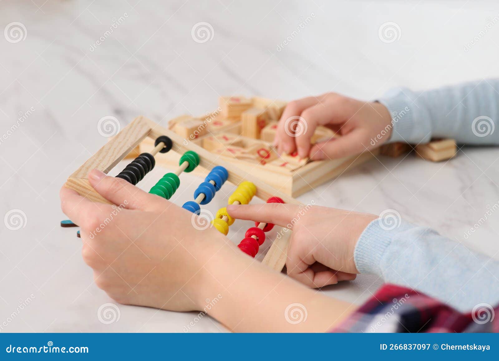 Mother and Daughter Playing with Different Math Game Kits at White ...