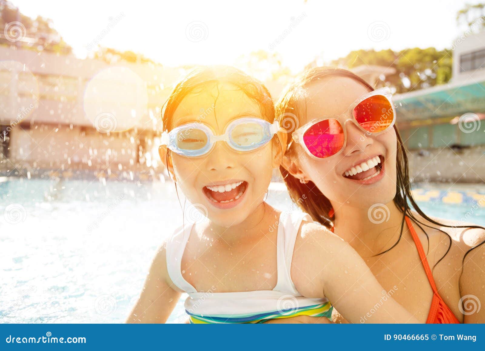 Mother and Daughter Playing in Swimming Pool Stock Image - Image of ...