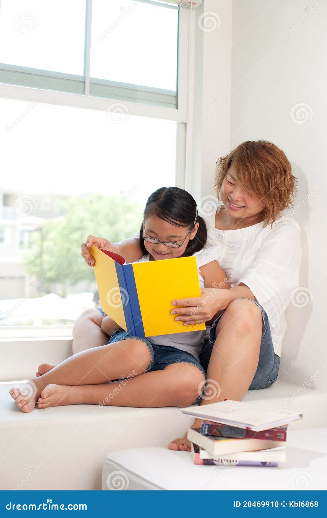 Mother and Daughter Reading a Book Stock Photo - Image of girl, sitting ...