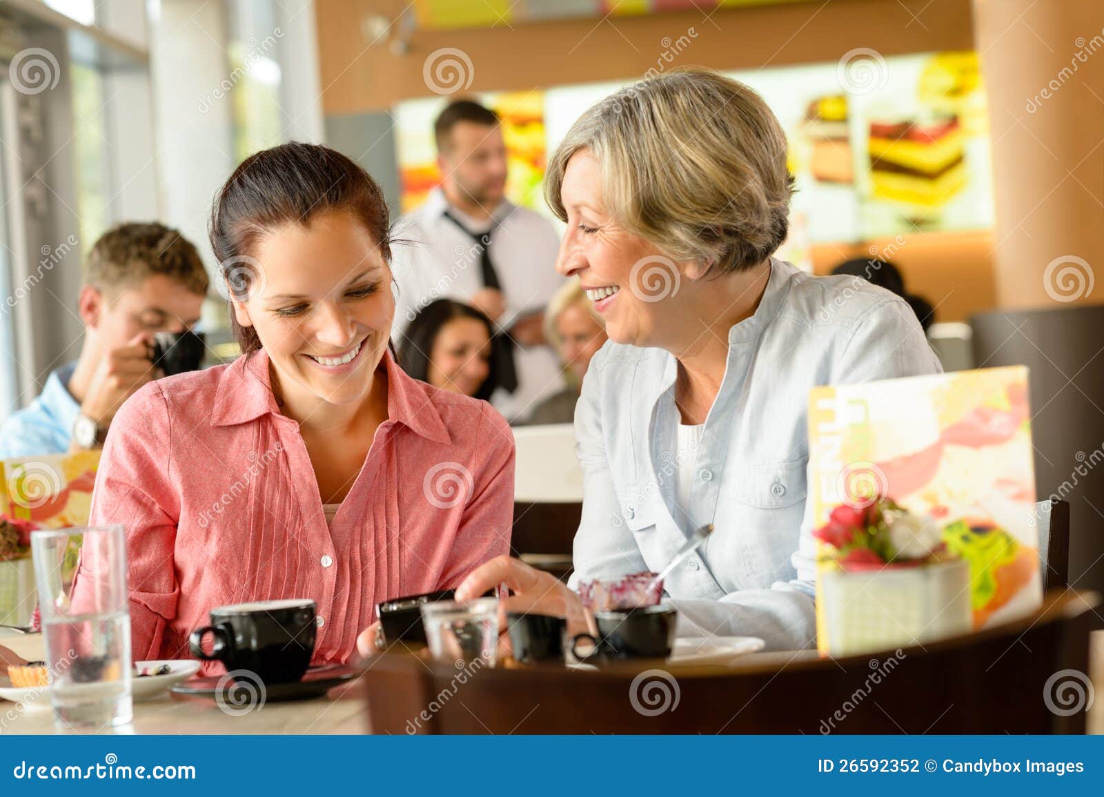 Mother and Daughter Relaxing in a Cafe Stock Photo - Image of ...