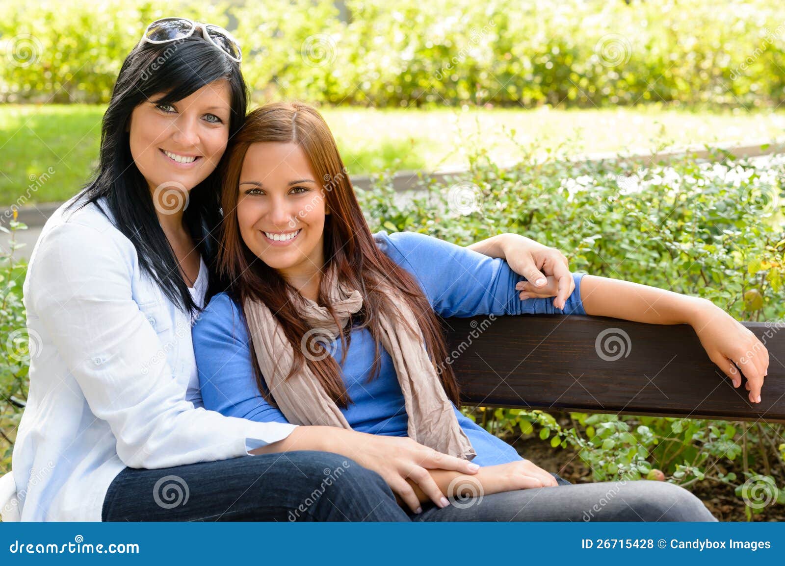 Mother and Daughter Relaxing on Park Bench Stock Photo - Image of ...