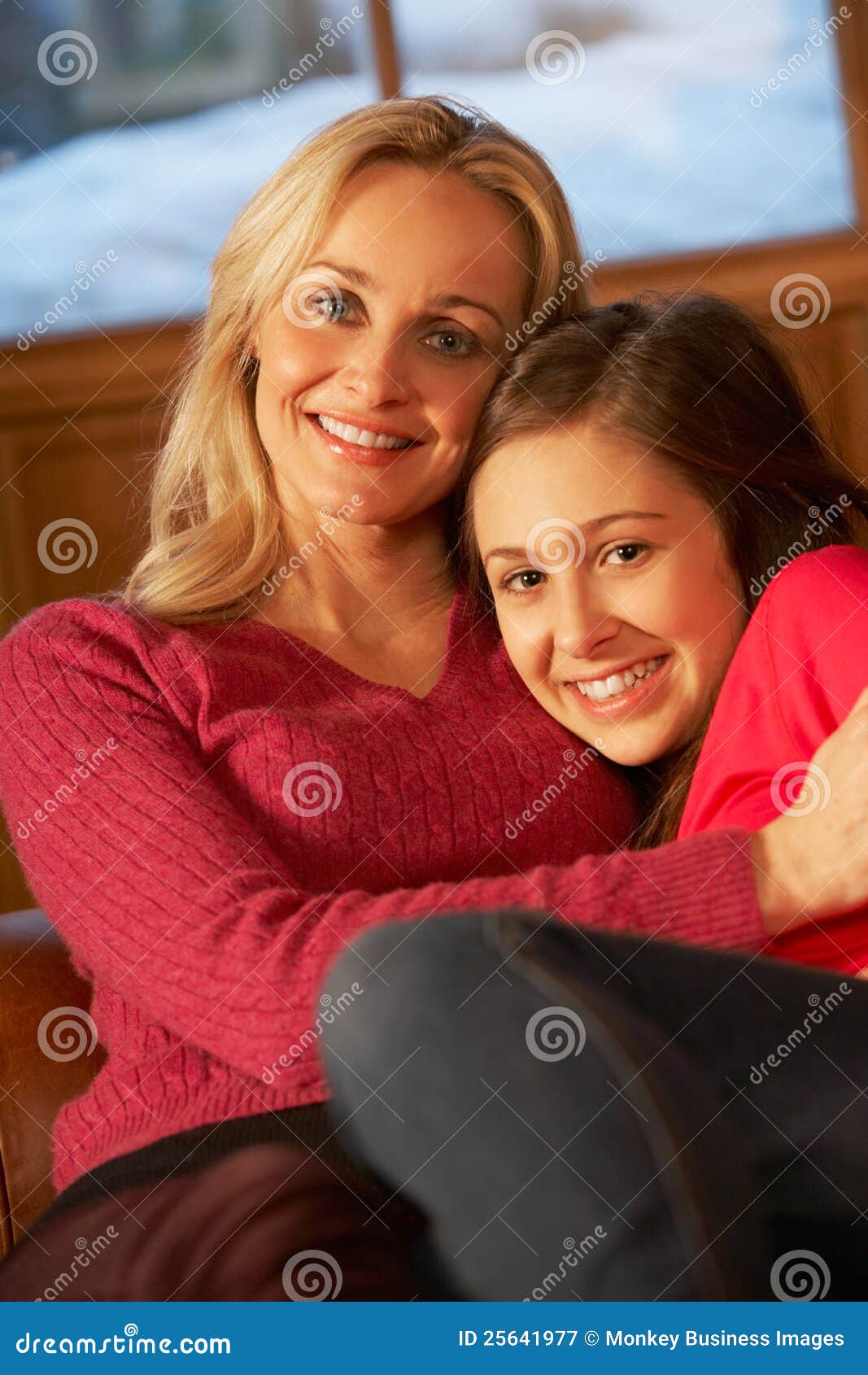 Mother and Daughter Relaxing on Sofa Together Stock Image - Image of ...