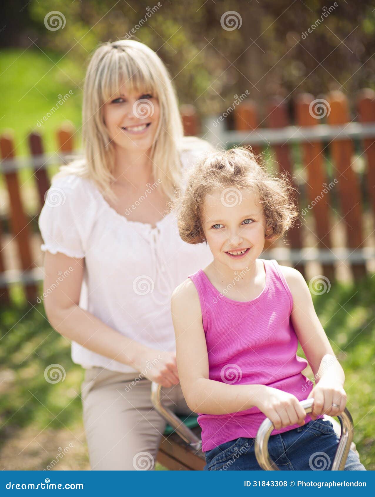 Mother and Daughter Ride Seesaw Together Stock Photo - Image of women ...