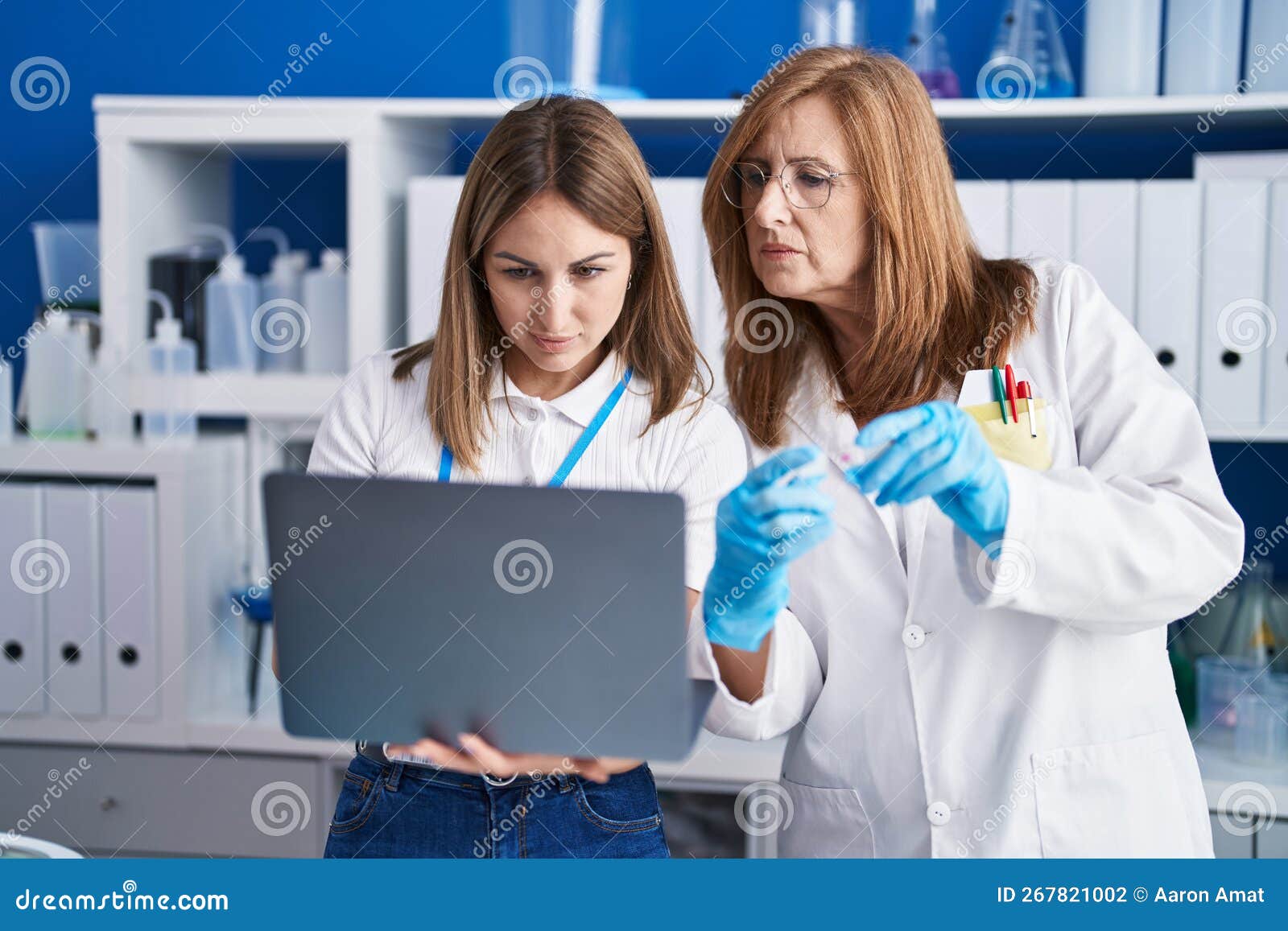 Mother and Daughter Scientists Using Laptop Working at Laboratory Stock ...