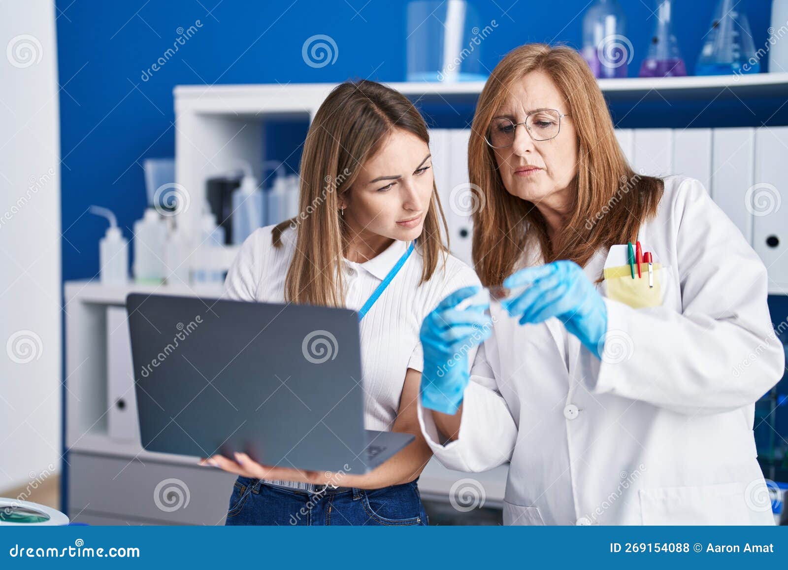 Mother and Daughter Scientists Using Laptop Working at Laboratory Stock ...