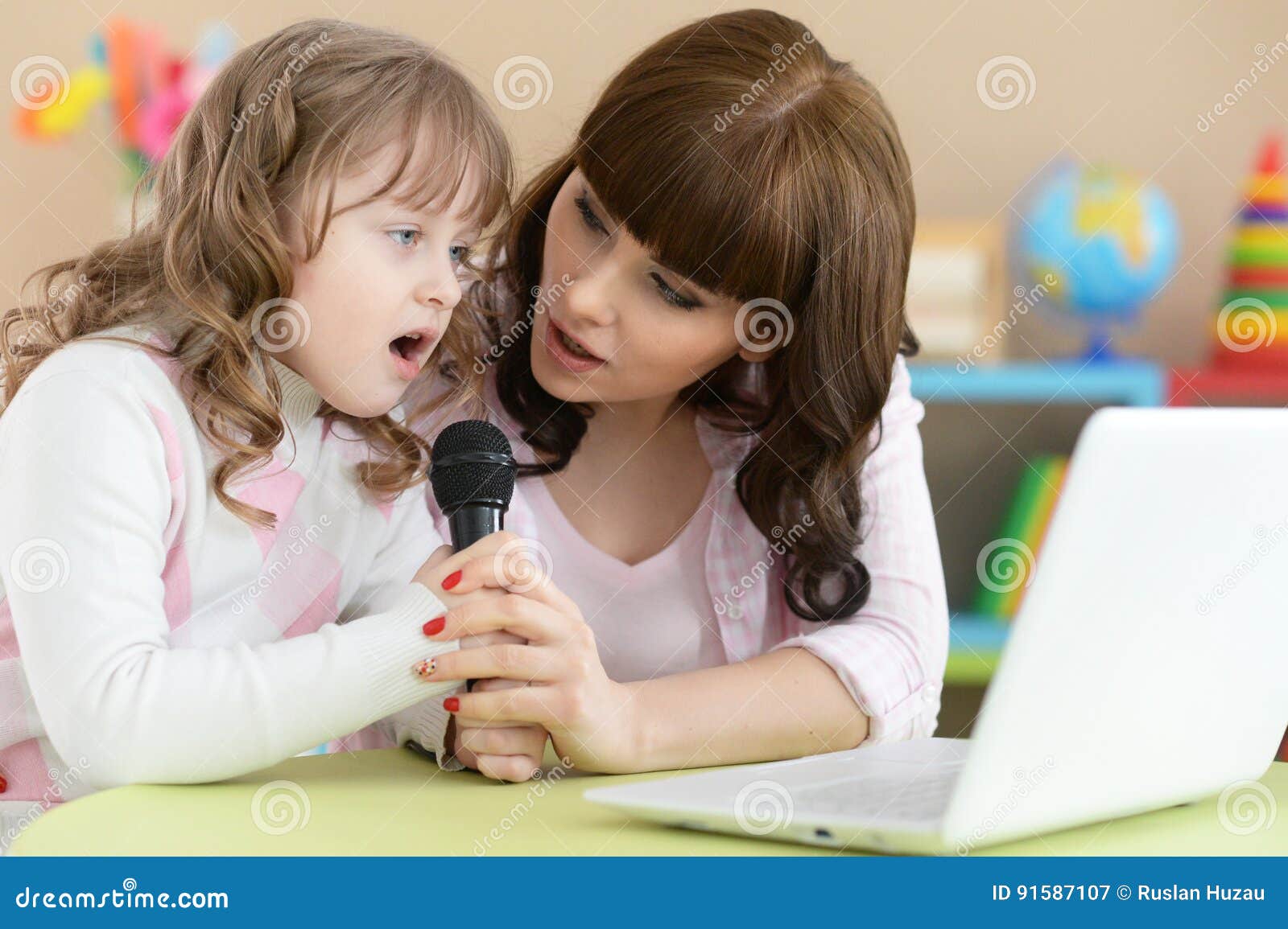 Mother and Daughter Singing at Table Stock Image - Image of teacher ...