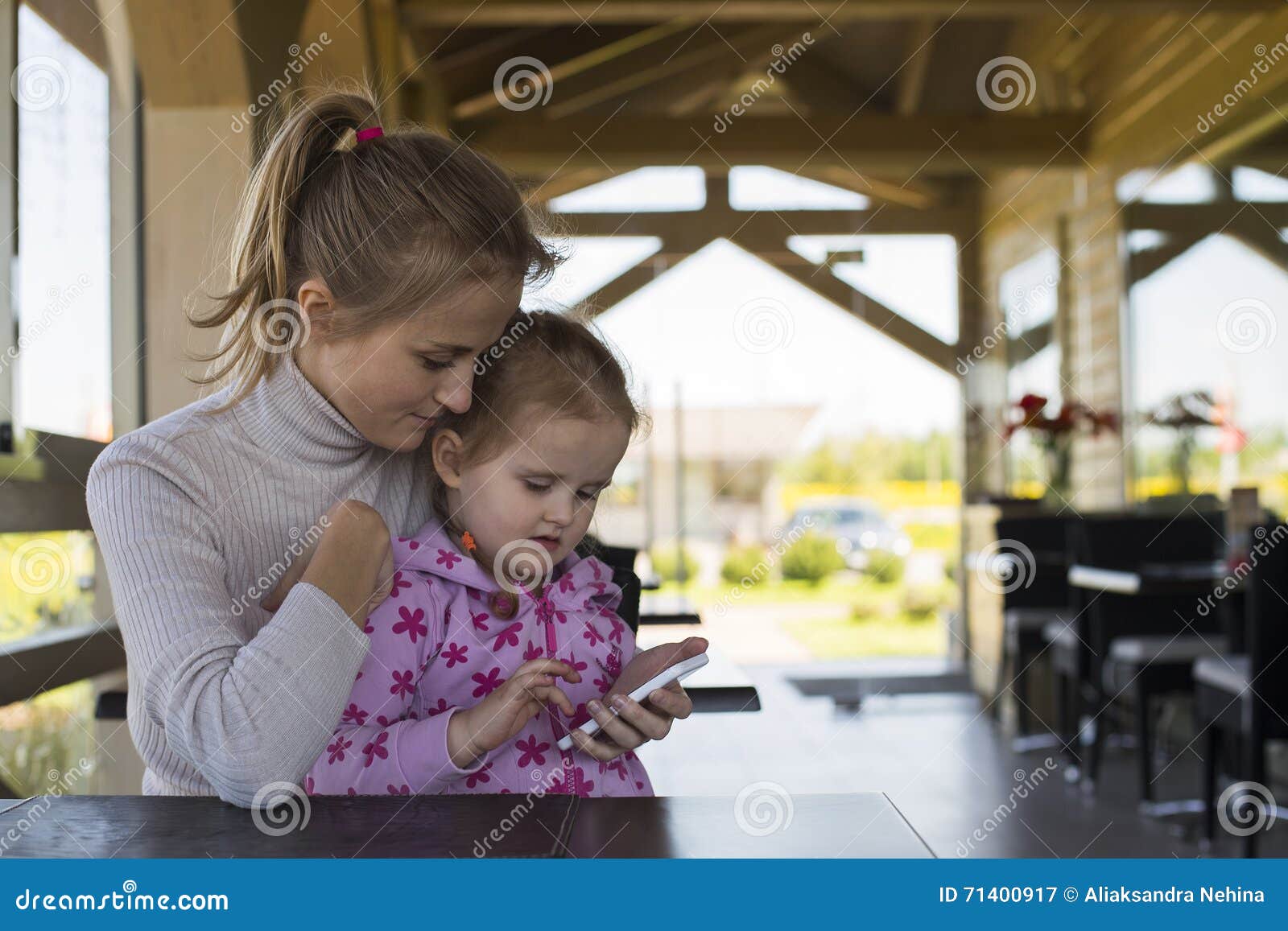 Mother and Daughter with Smartphone Stock Image - Image of caucasian ...
