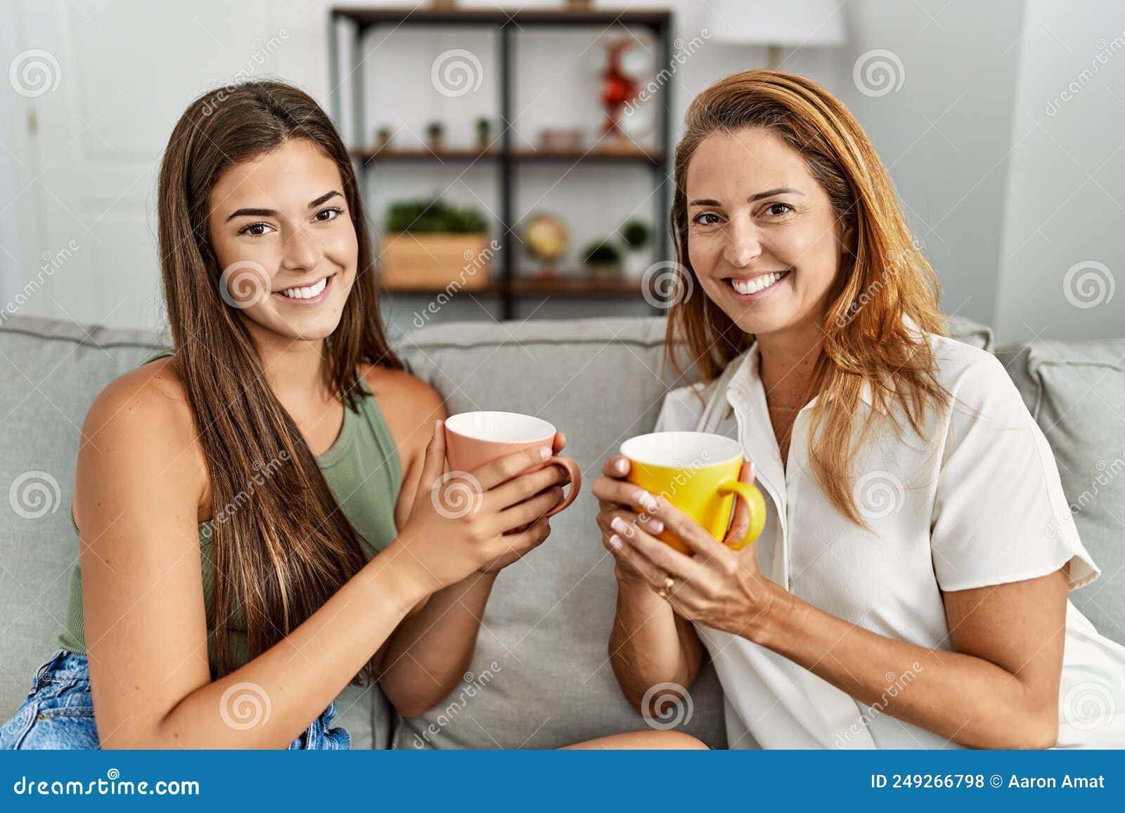Mother and Daughter Smiling Confident Drinking Coffee at Home Stock ...