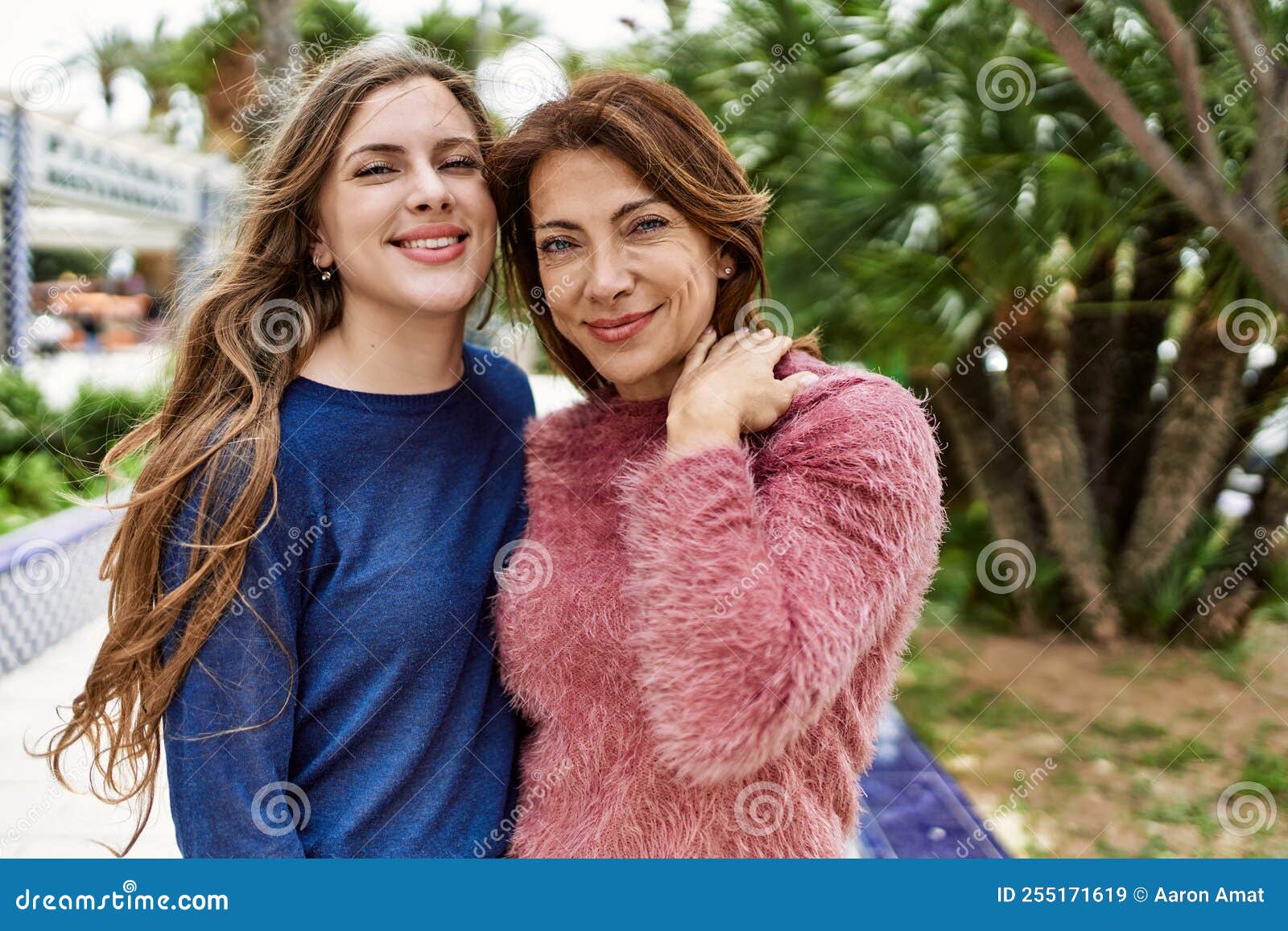 Mother And Daughter Smiling Confident Hugging Each Other At Park Stock