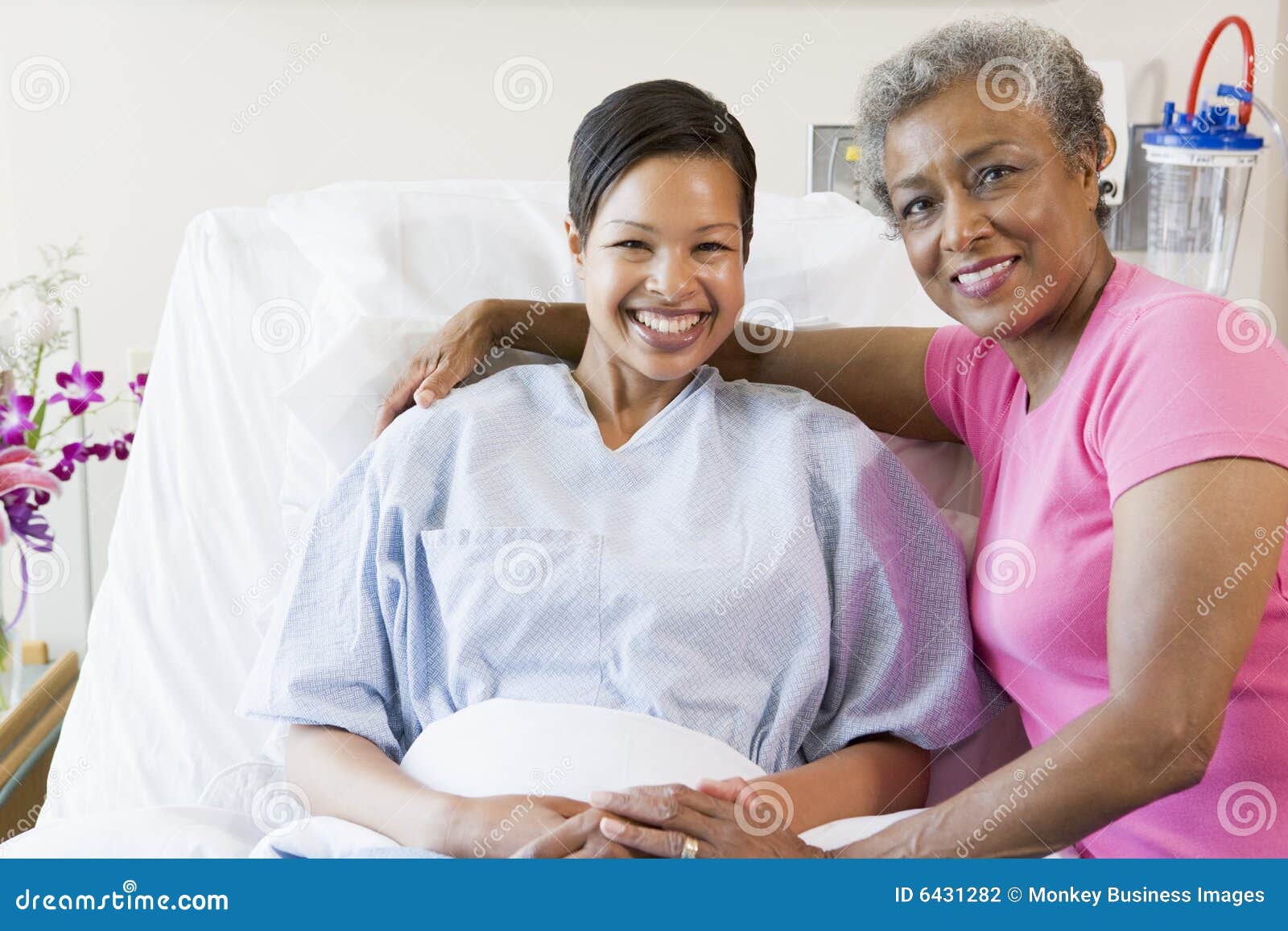 Mother and Daughter Smiling in Hospital Stock Photo - Image of ...