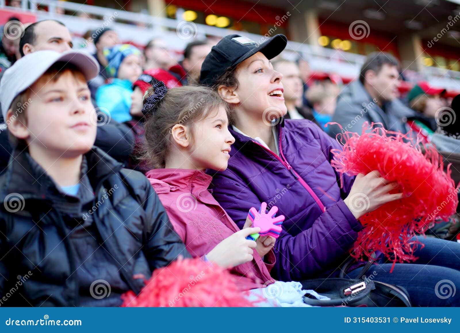 Mother with Daughter and Son among Fans at Stock Image - Image of ...