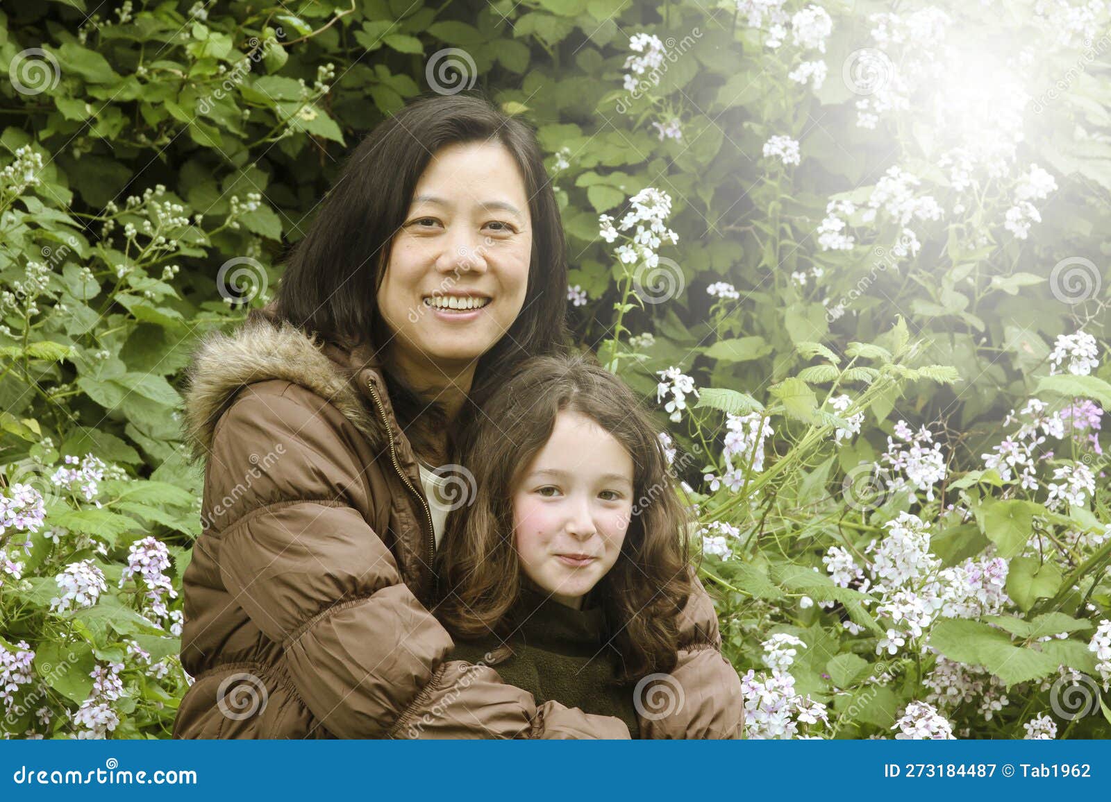 Mother and Daughter with Spring Flowers during Bright Day Stock Image ...