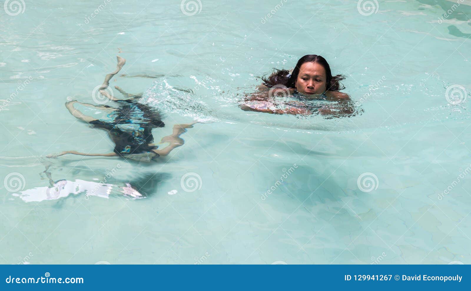 Mother And Daughter Swimming In Pool Stock Image Image Of Person