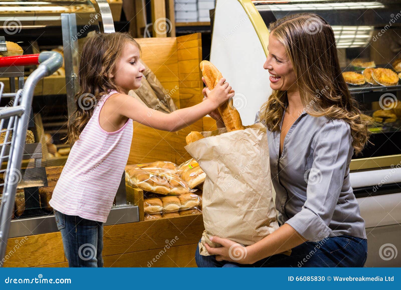Mother and Daughter Taking Bread Stock Photo - Image of bakery ...