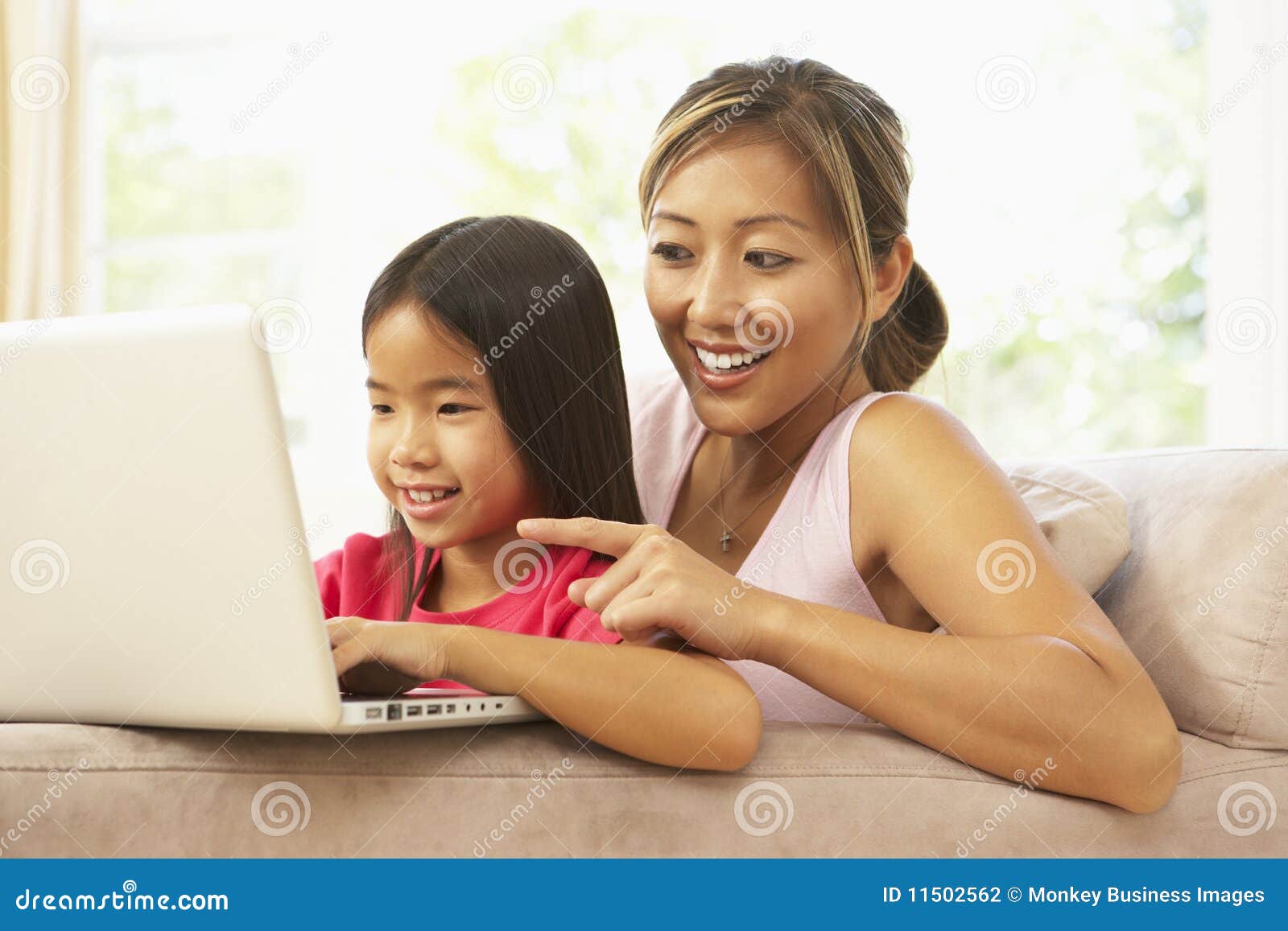 Mother and Daughter Using Laptop at Home Stock Photo - Image of chinese ...