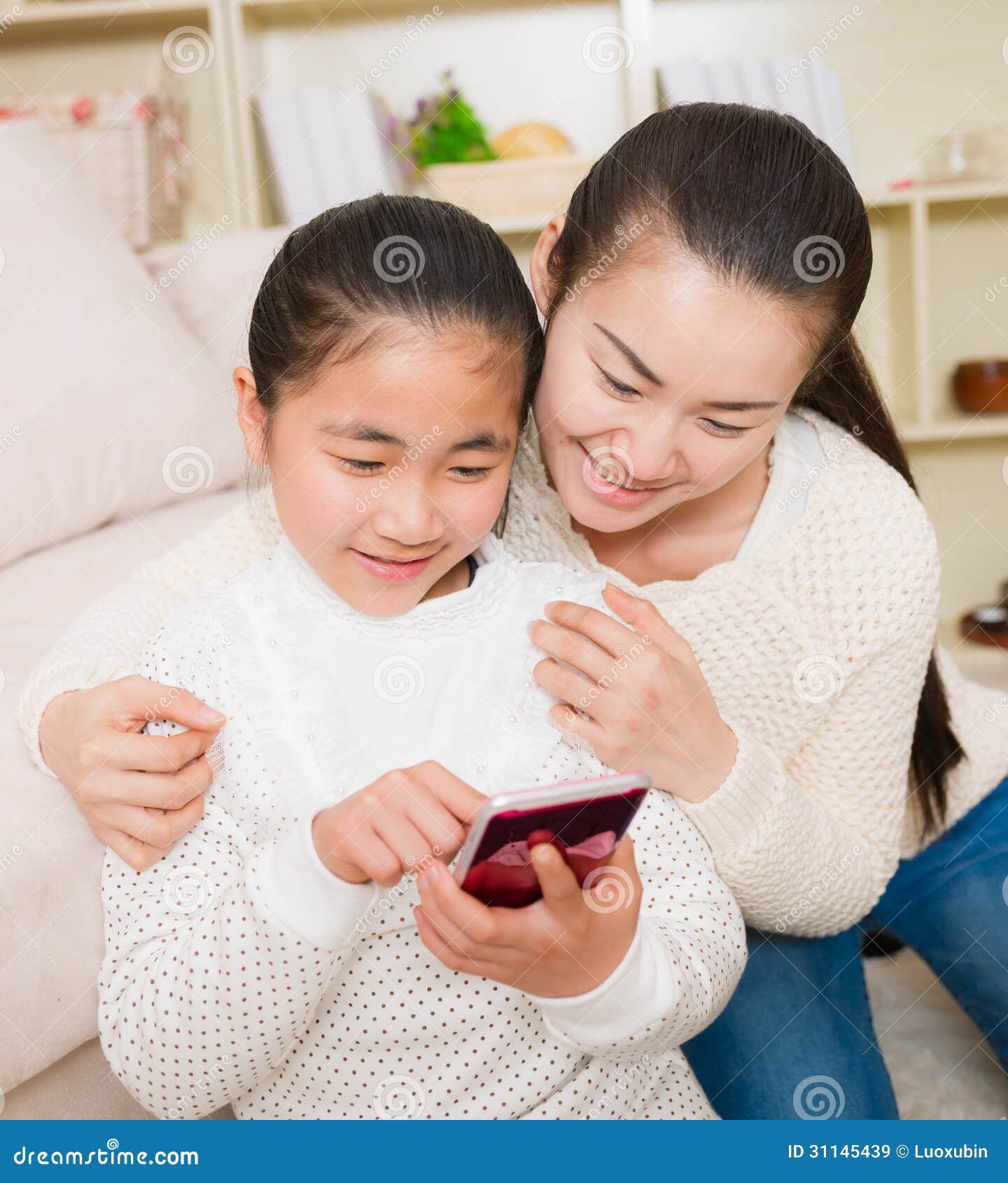 Mother and Daughter Using Smart Phone Stock Image - Image of daughter ...