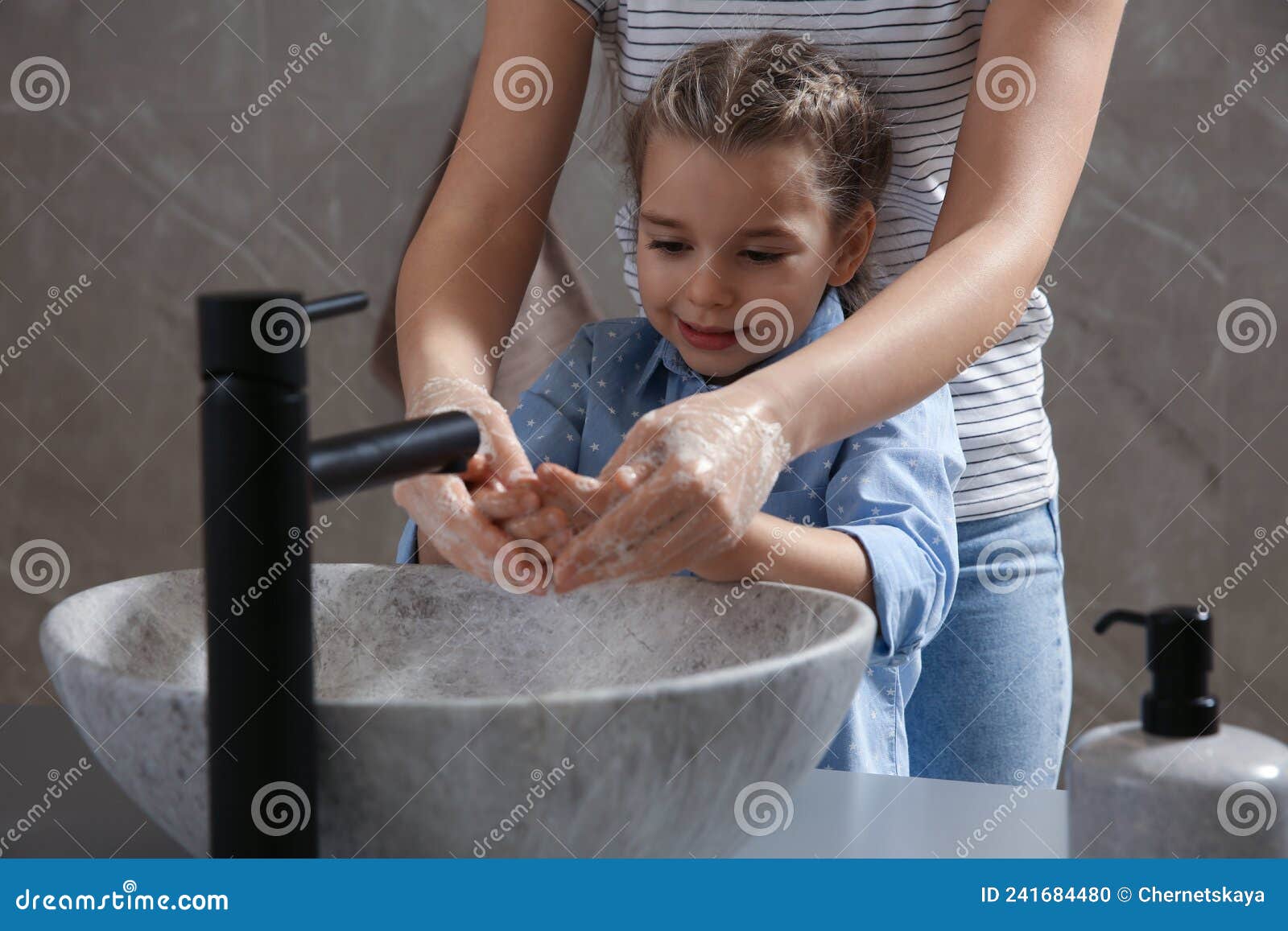 Mother and Daughter Washing Hands with Liquid Soap Together in Bathroom ... Mother and Daughter Washing Hands with Liquid Soap Together in Bathroom ...