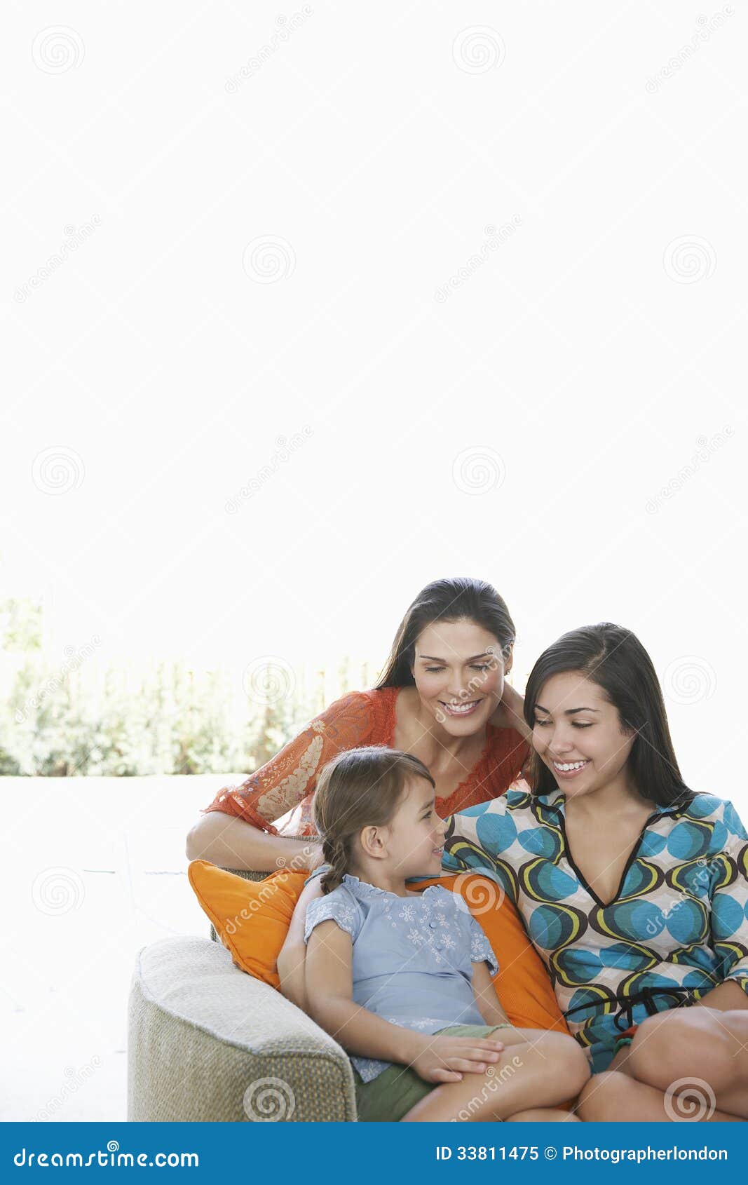 Mother With Daughters Relaxing On Sofa Stock Image Image Of Bonding