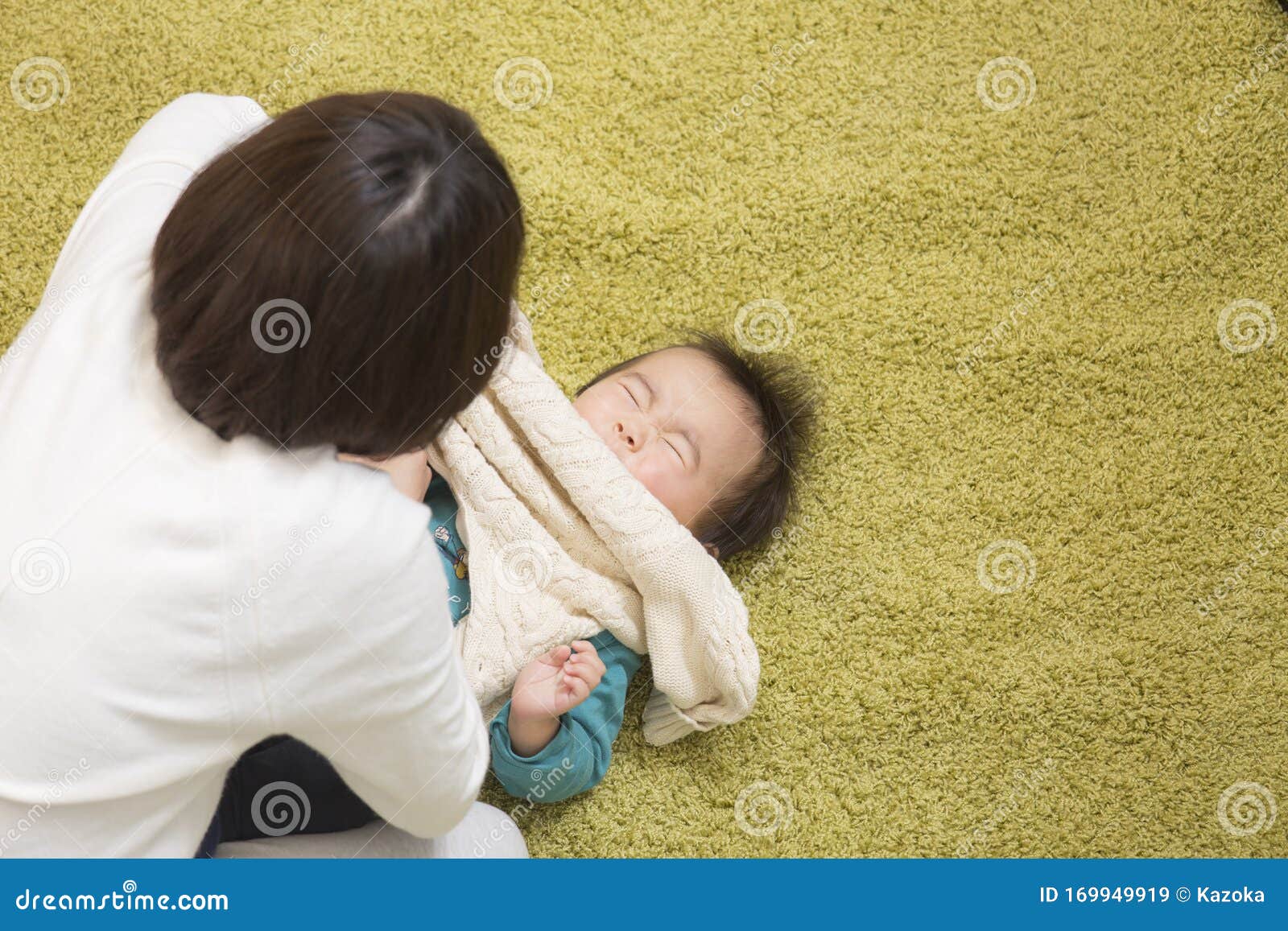 Infants disliking clothes stock image. Image of baby - 169949919