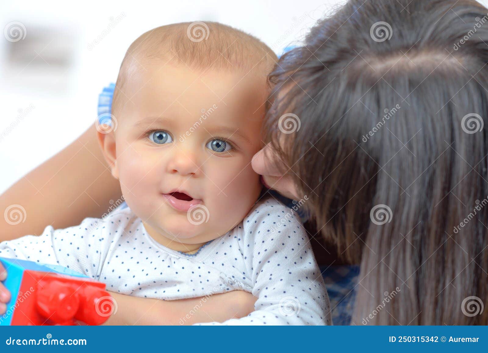 Mother embracing baby stock photo. Image of kiss, life - 250315342