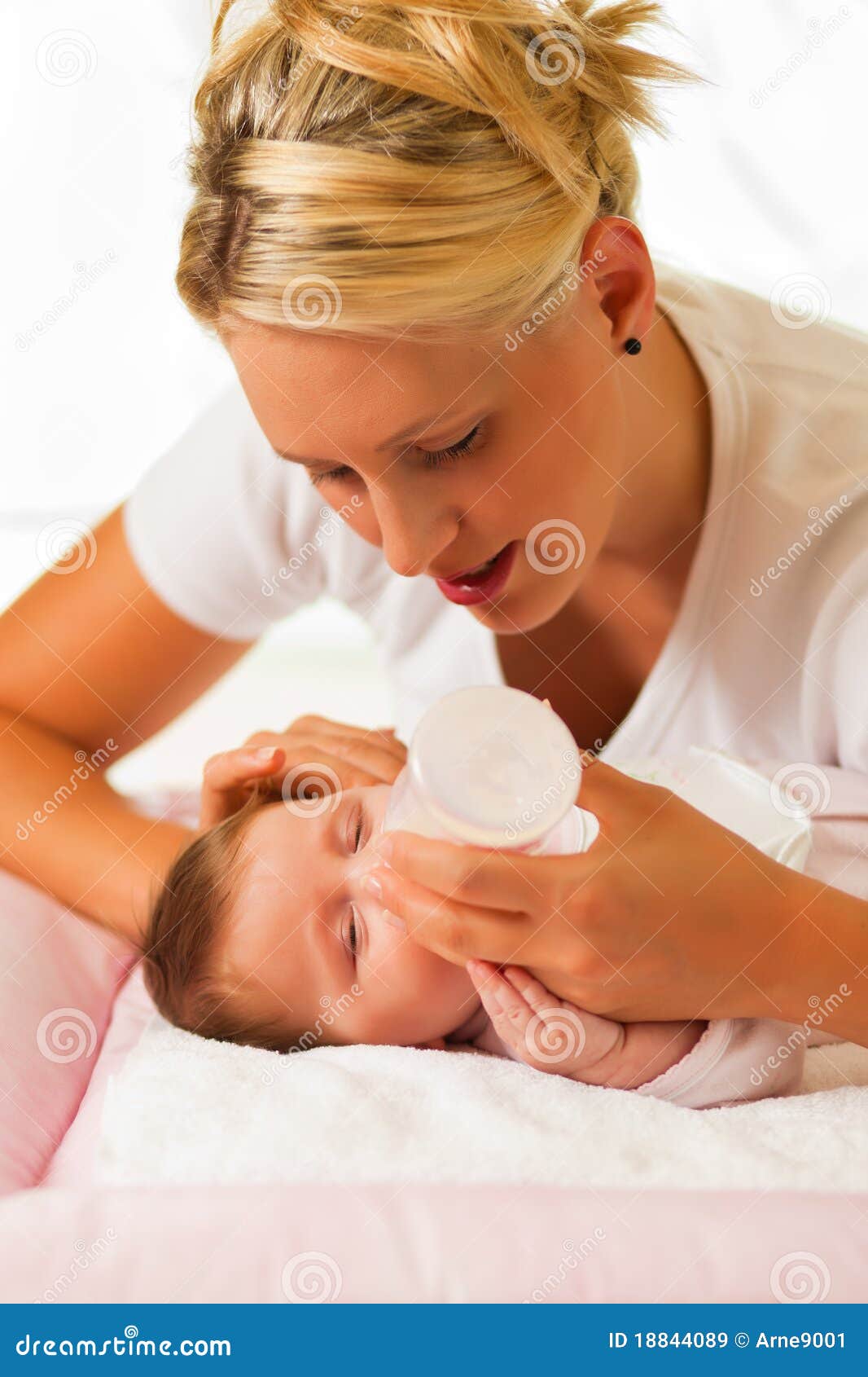 Mother is feeding the baby stock image. Image of health - 18844089