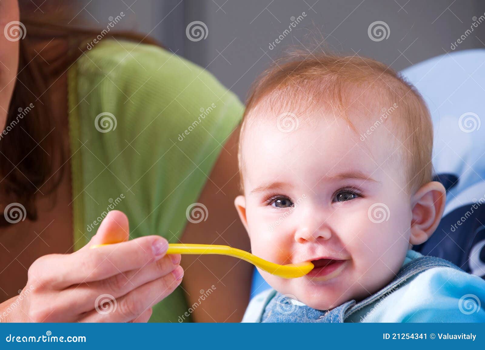 Mother feeding hungry baby stock image. Image of dinner - 21254341