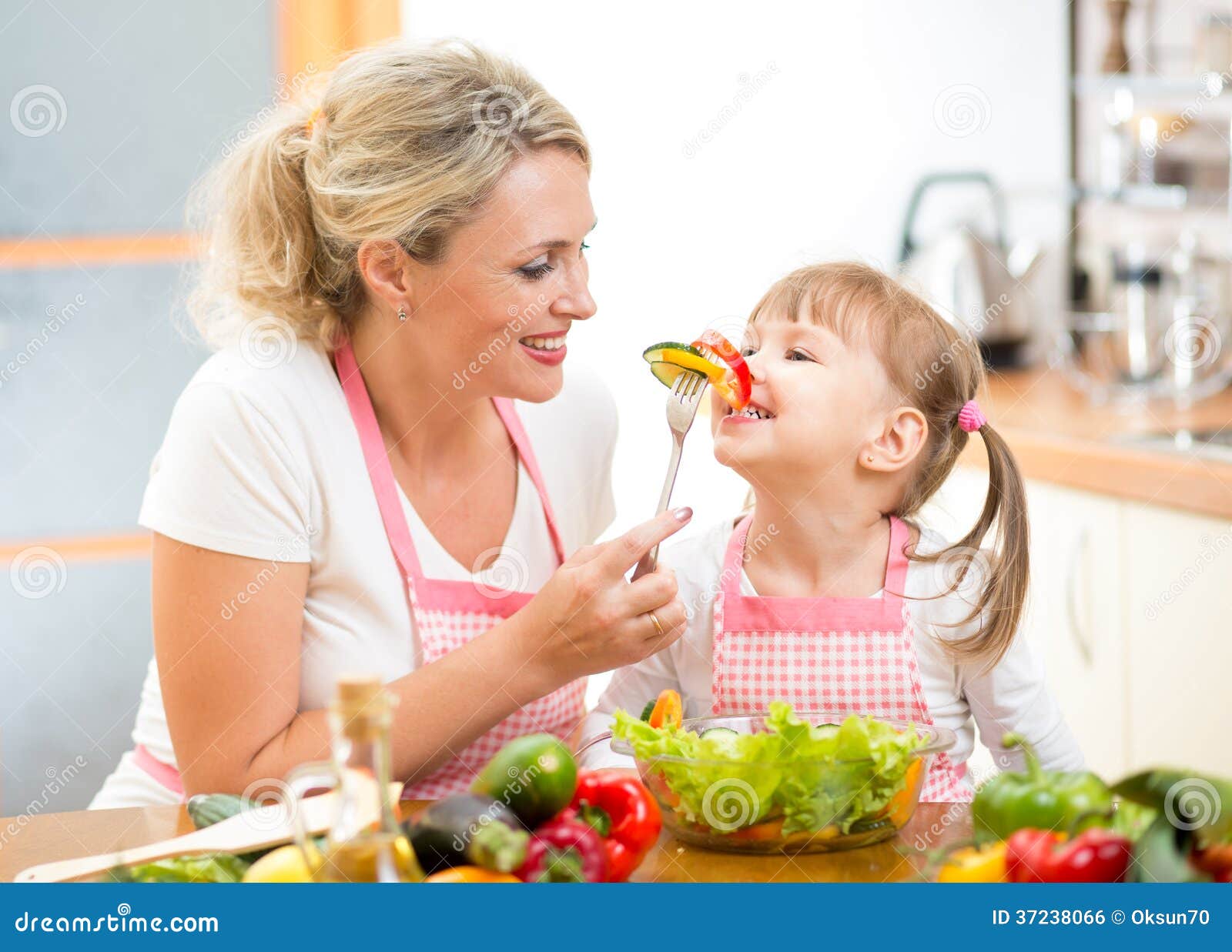 Mother Feeding Kid Daughter Vegetables Stock Photo - Image of cheerful ...
