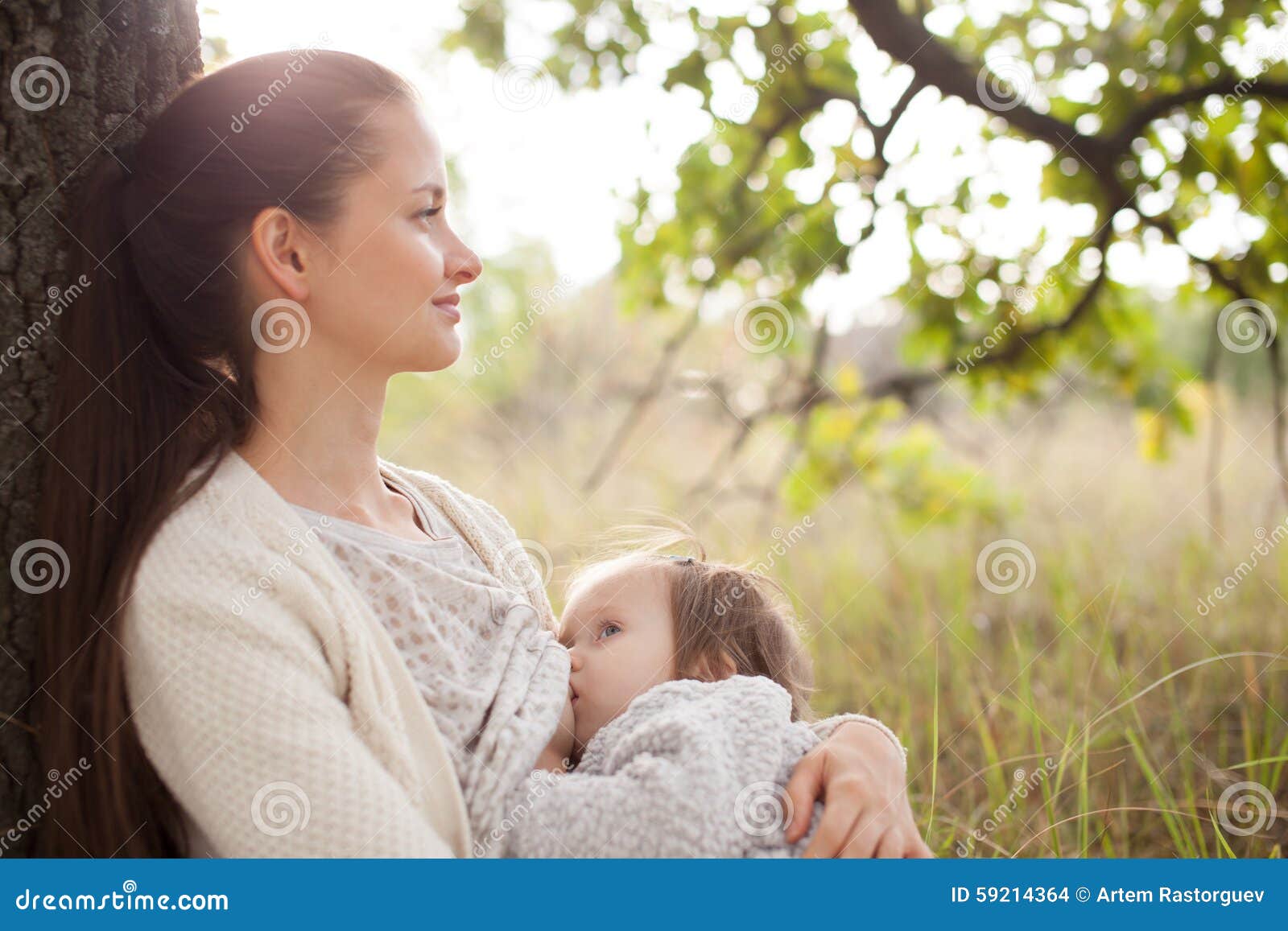 Mother Feeding Toddler Outdoors Stock Photo - Image of feed, lifestyle ...