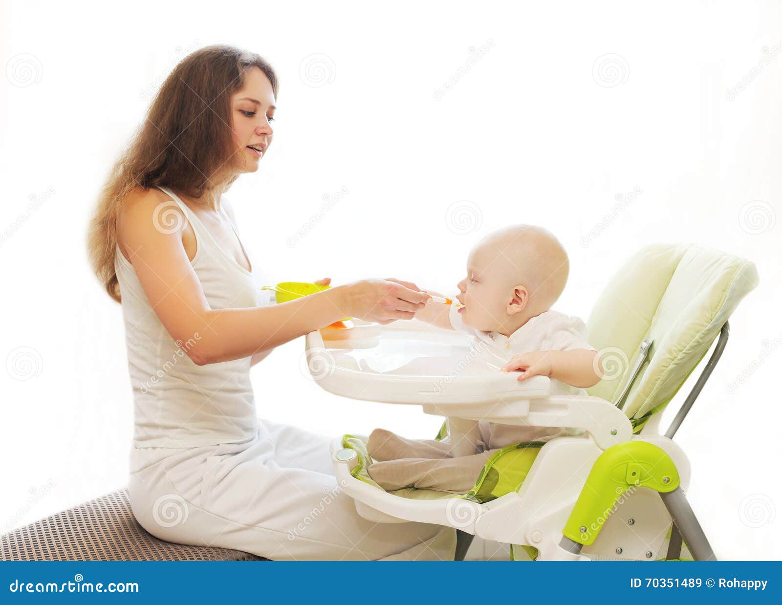 Mother Feeds Baby Spoon Sitting for Table Home Stock Image - Image of ...