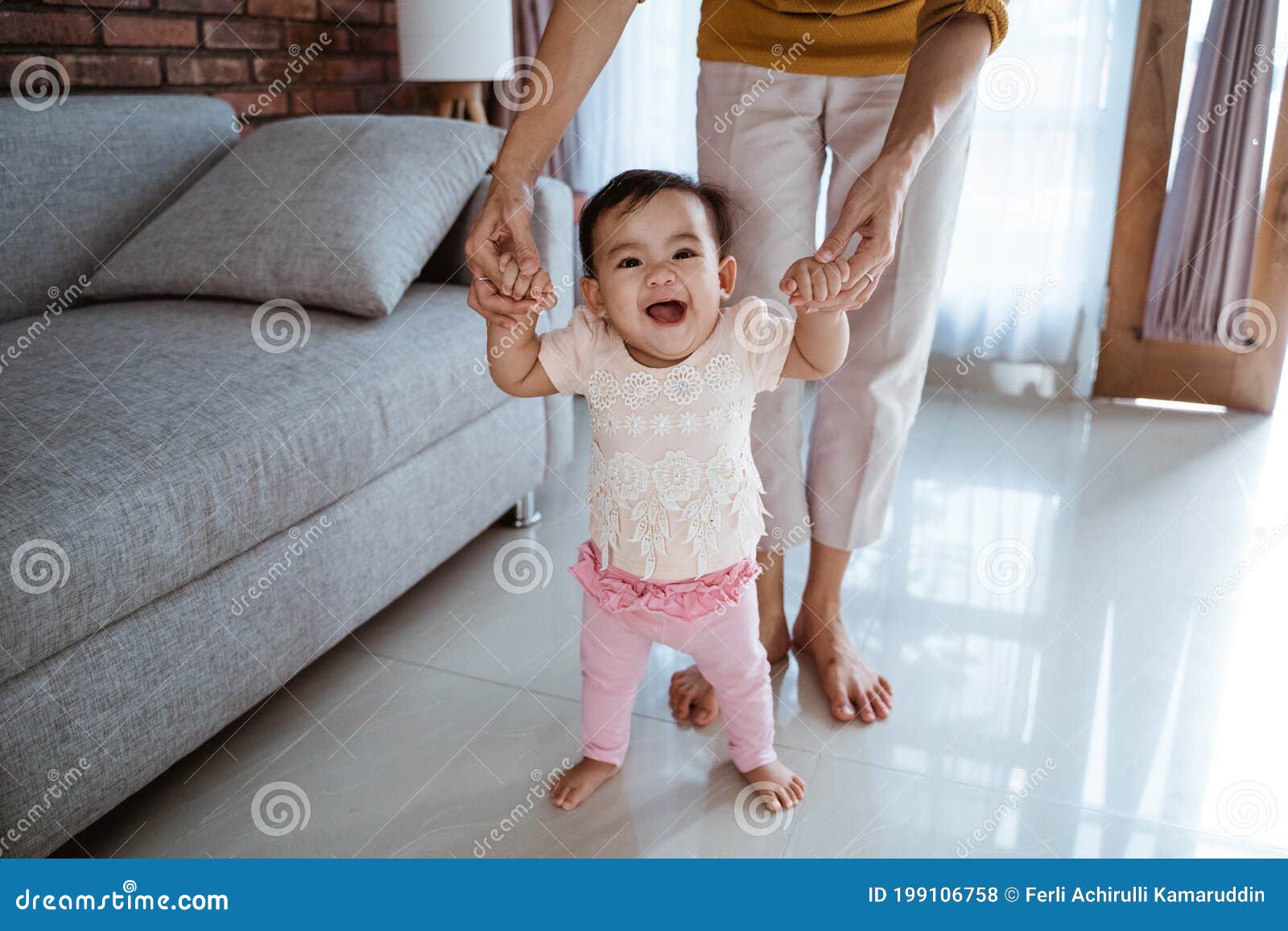 Mother Help Her Baby To Walk Her First Step Stock Photo - Image of girl ...