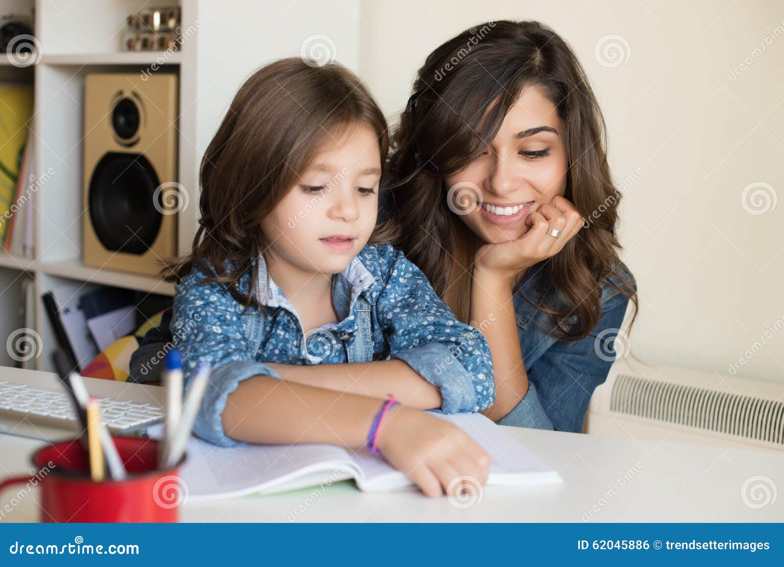 Mother Helping Child with Homework Stock Photo - Image of female ...