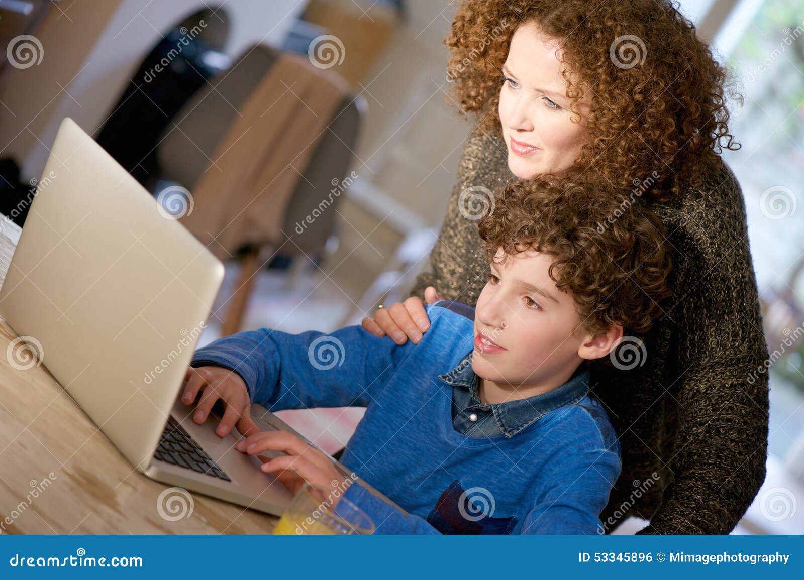 Mother Helping Her Son Use Computer at Home Stock Photo - Image of ...