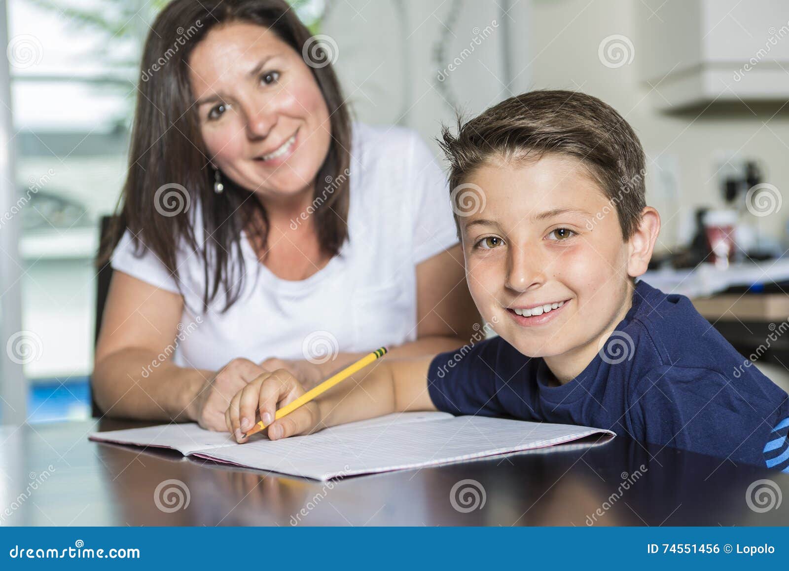 Mother Helping Son with Homework at Table Stock Photo - Image of ...