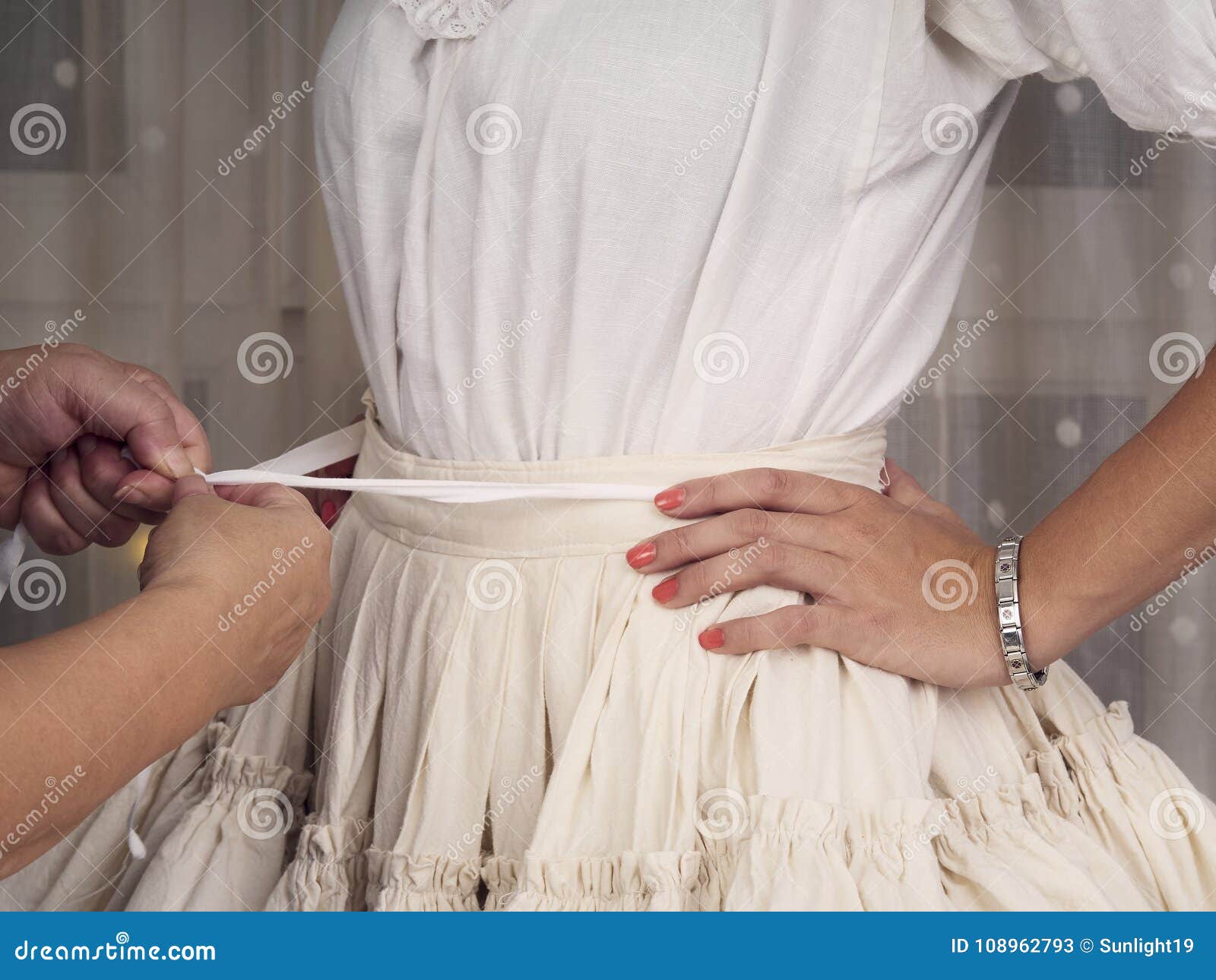 Mother Helps Her Daughter To Dress in a Regional Costume, Valencia ... Mother Helps Her Daughter To Dress in a Regional Costume, Valencia ...