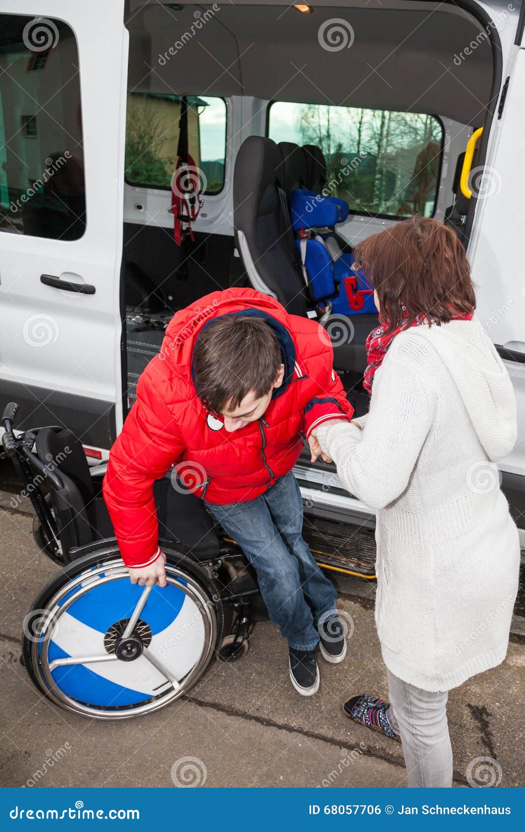 Mother Helps Her Handicapped Son Off the School Bus. Stock Photo ...